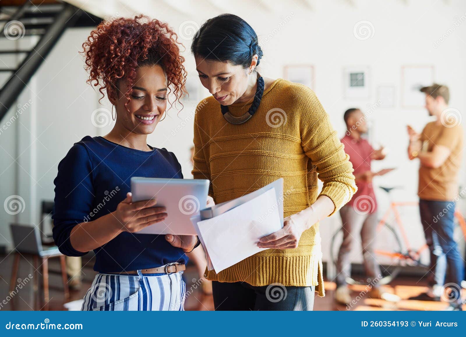 Getting it Done Right with Teamwork. Two Designers Discussing Something ...