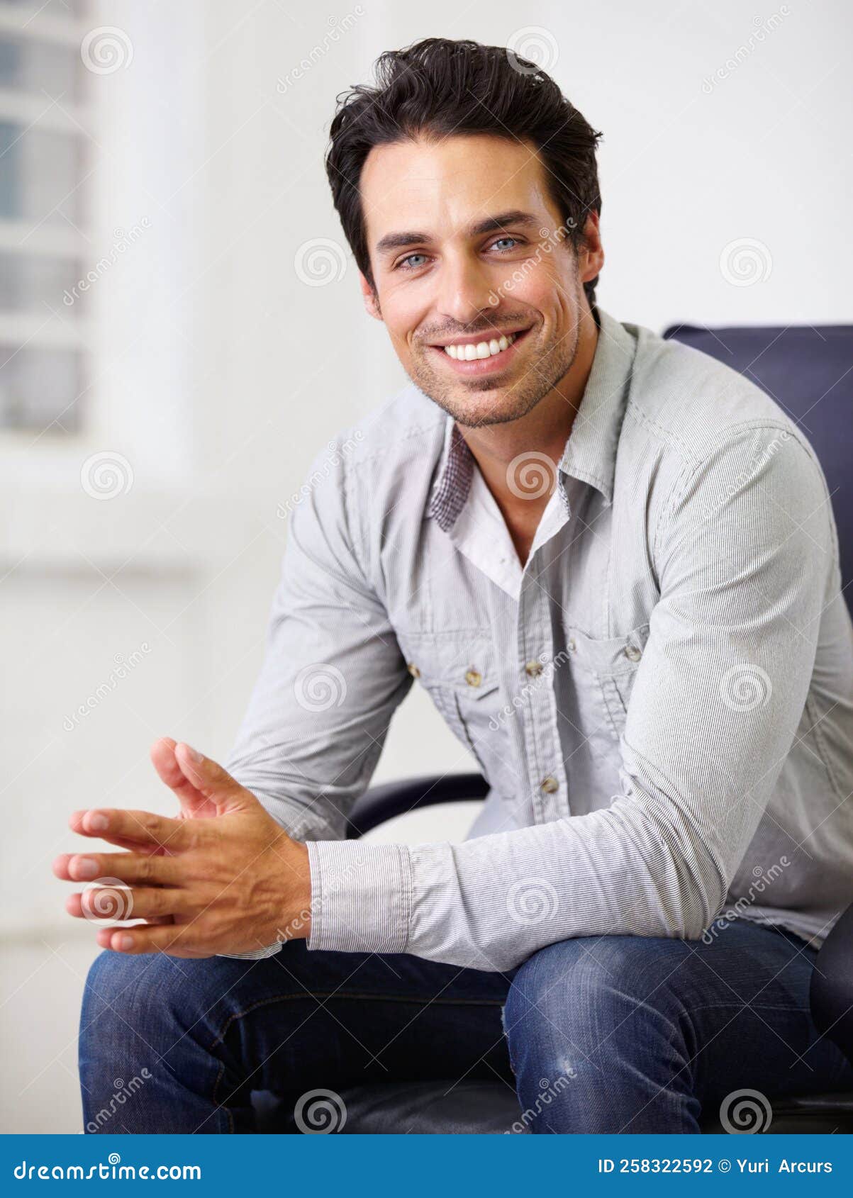 Getting Down To Business. a Handsome Young Sitting in a Chair. Stock ... Getting Down To Business. a Handsome Young Sitting in a Chair. Stock ...
