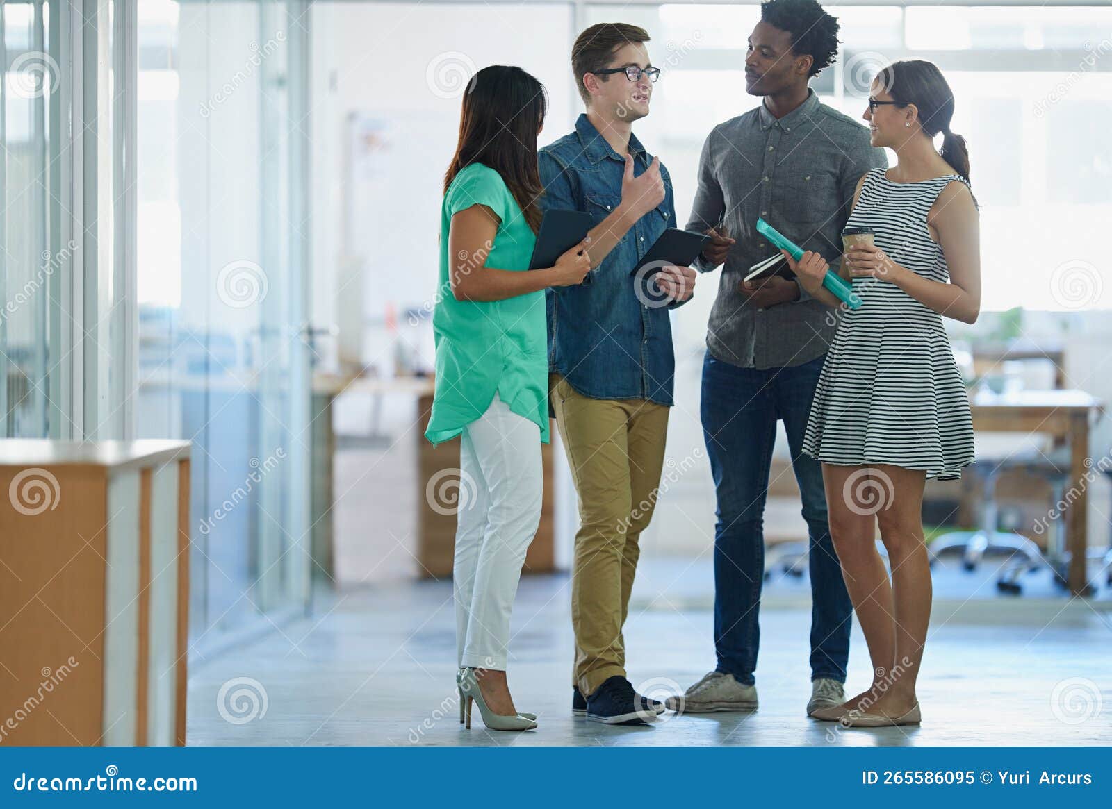 Getting Down To Business in the Office. a Diverse Group of Colleagues ...