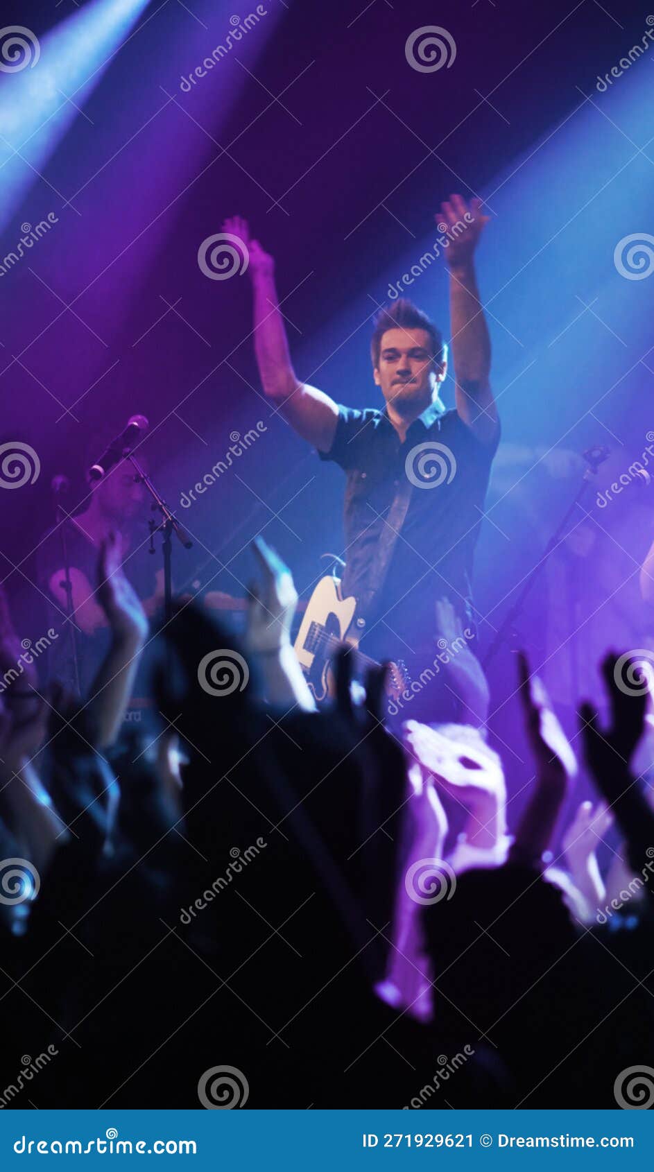 Getting the Fans Pumped. a Performer Interacting with the Crowd at a ...