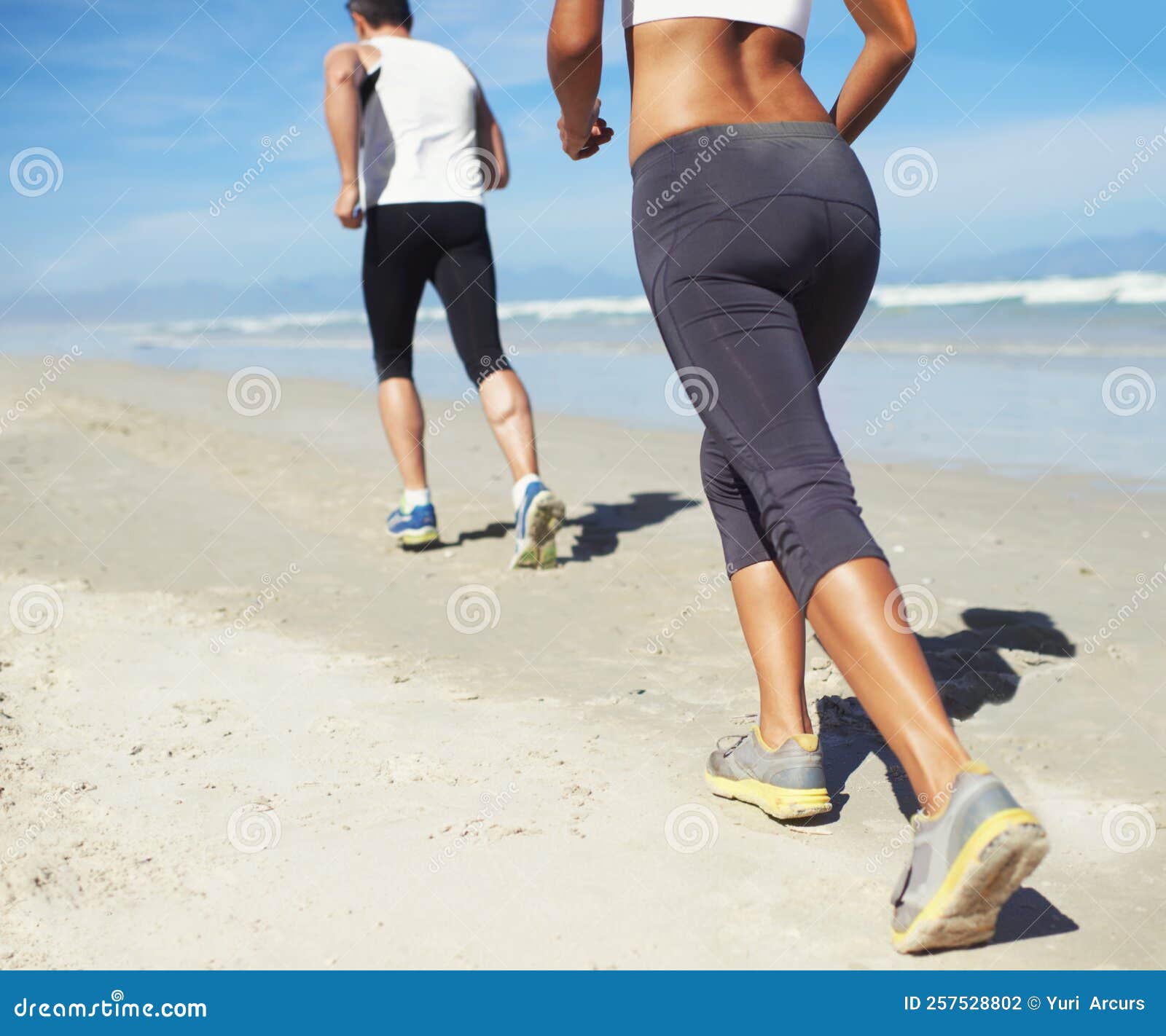 Getting Fit Together. Two People Running on the Beach. Stock Photo ...