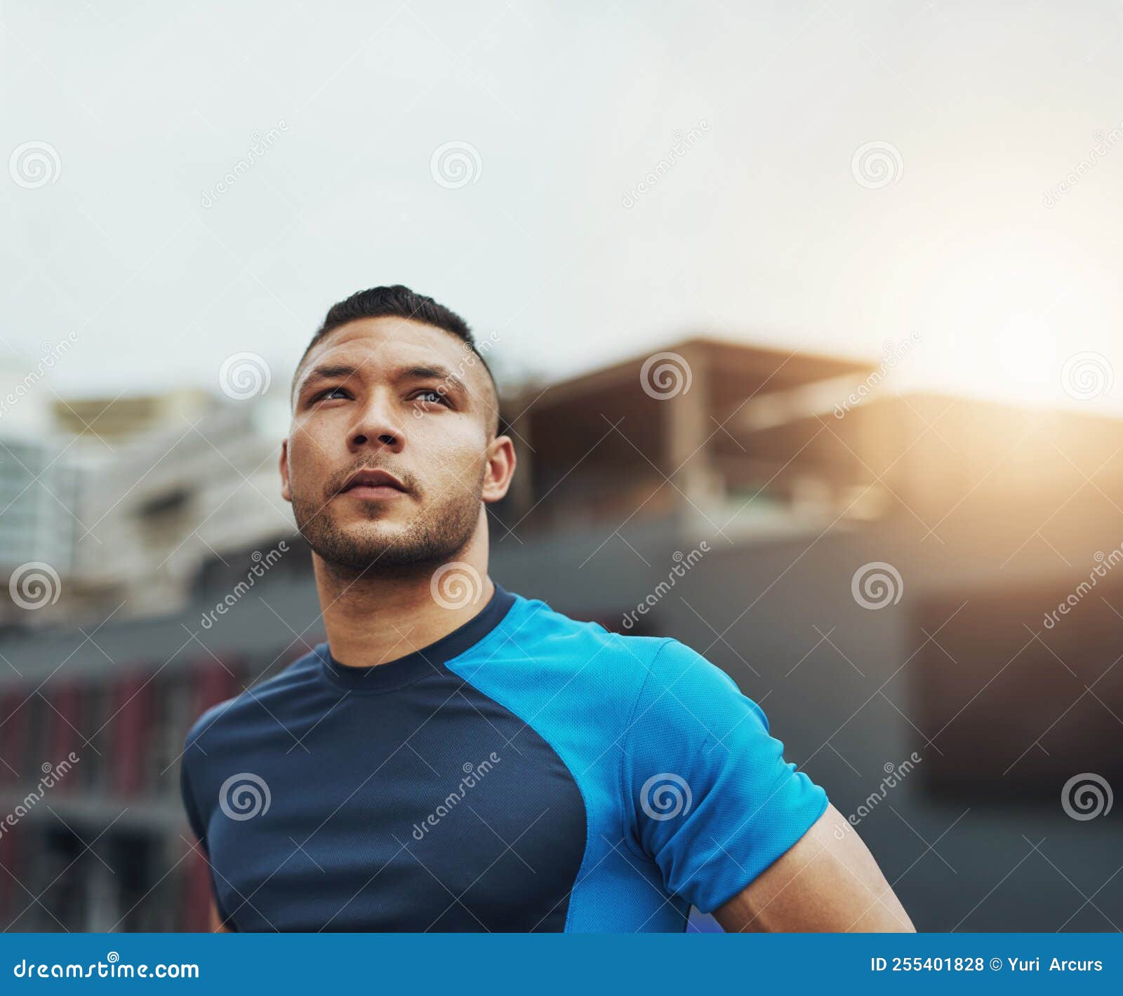 Getting Focused before His Run. a Young Man Out for a Run in the City ...