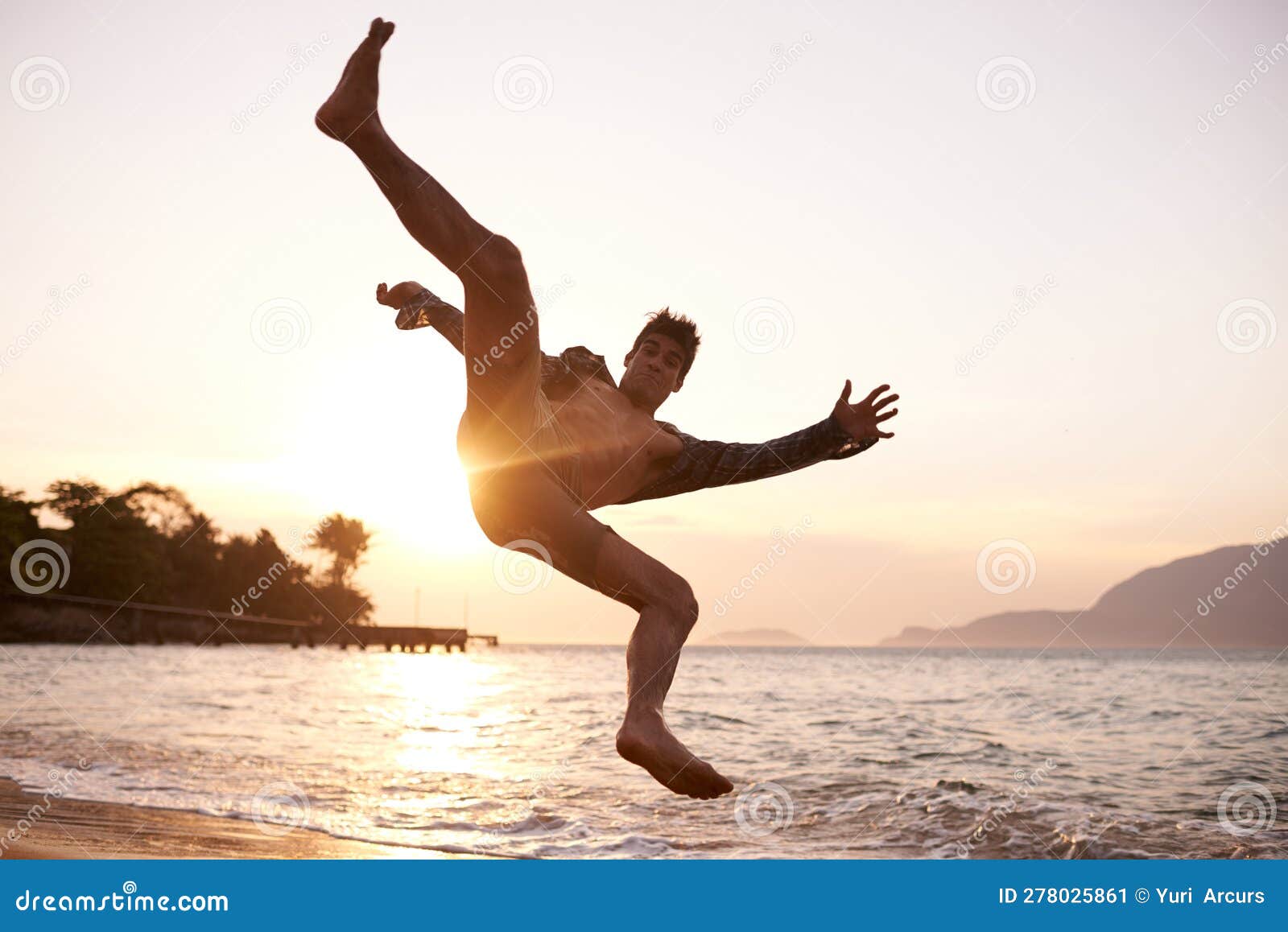 Getting His Groove on. a Young Man Dancing on the Beach. Stock Image ...