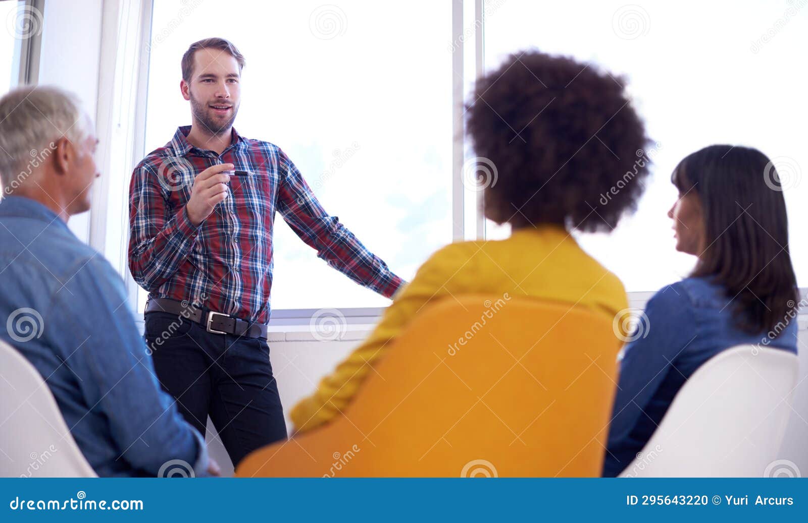 Getting His Point Across. a Group of People in a Meeting. Stock Photo ...