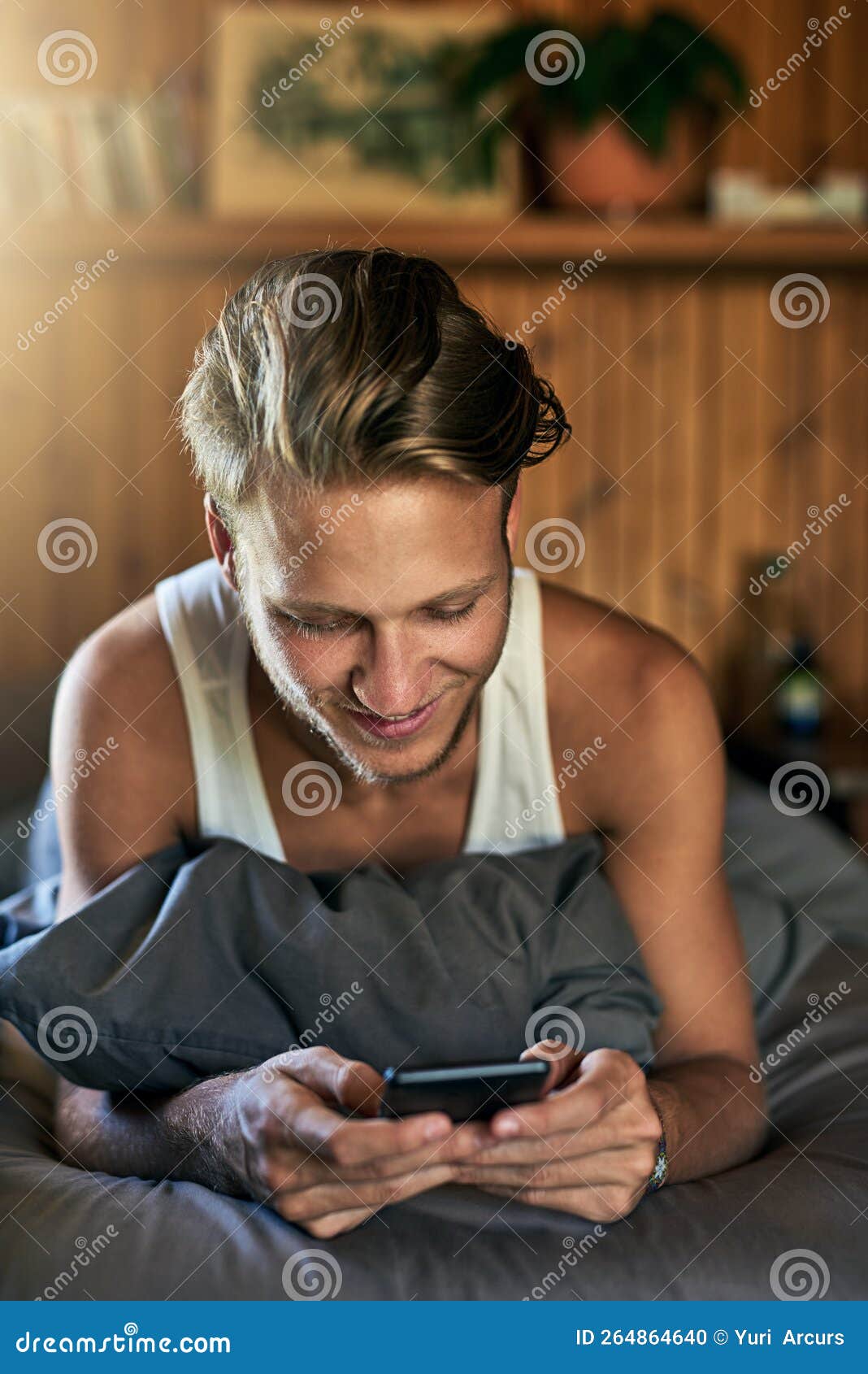 Getting His Weekend Plans in Order. a Young Man Texting on His ...