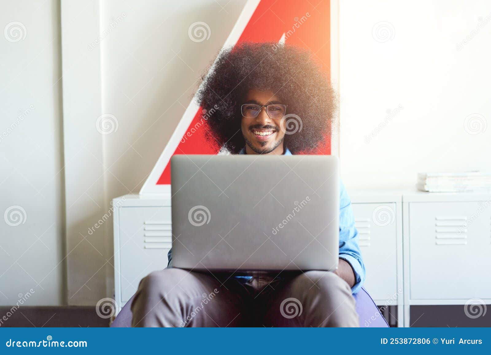 Getting His Work Done Anywhere in the Office. a Young Creative Employee ...