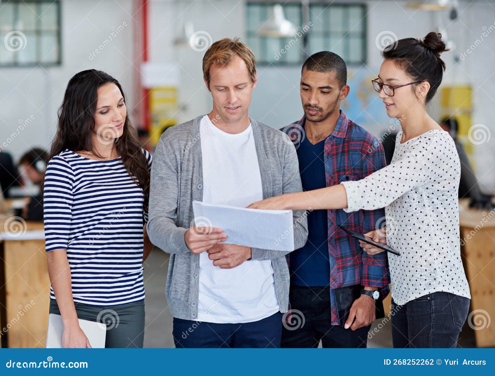 Getting Input from the Crew. a Group of Creative Businesspeople ...