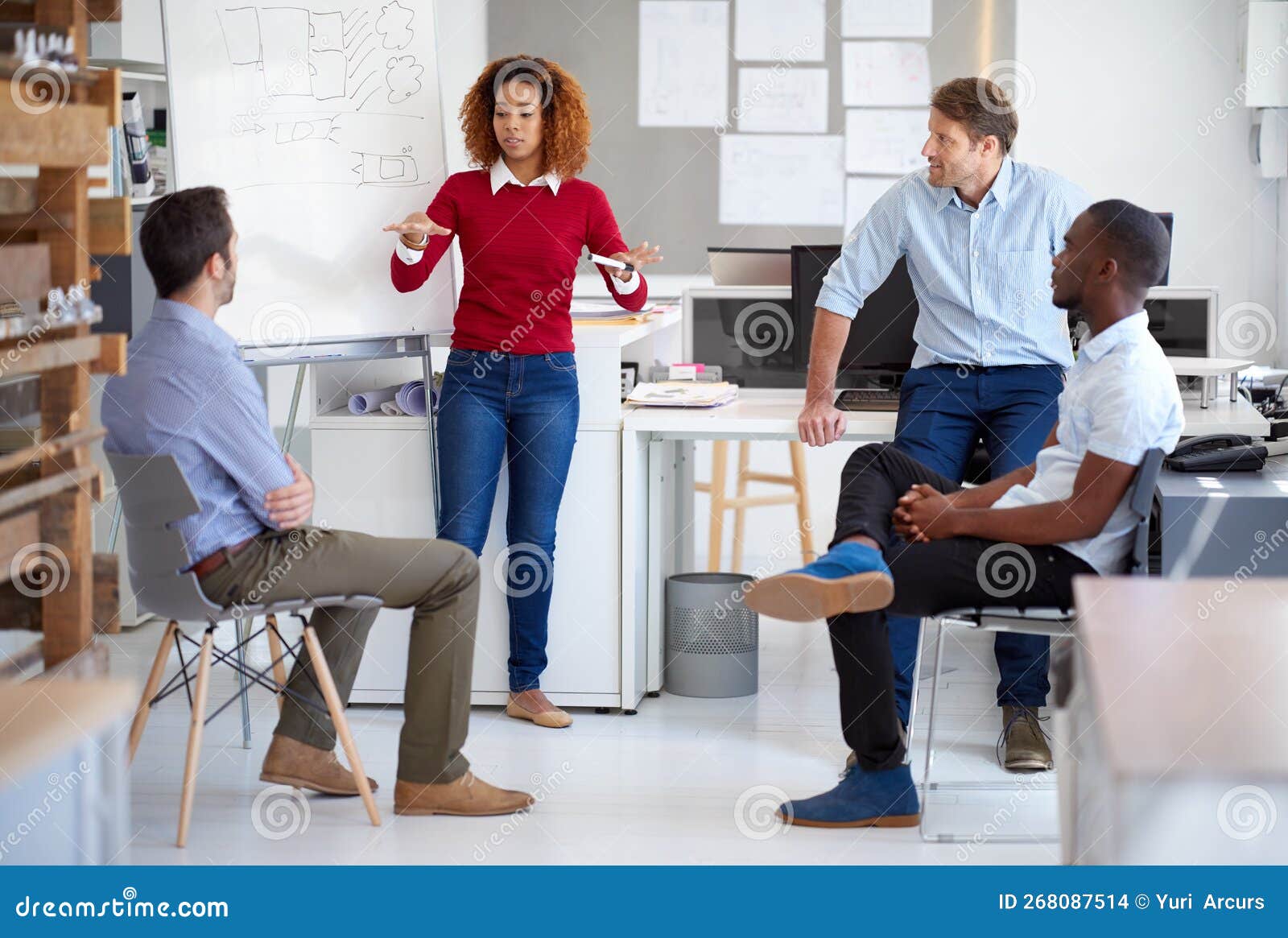 Getting Input from the Crew. a Group of Designers Talking Together in a ...