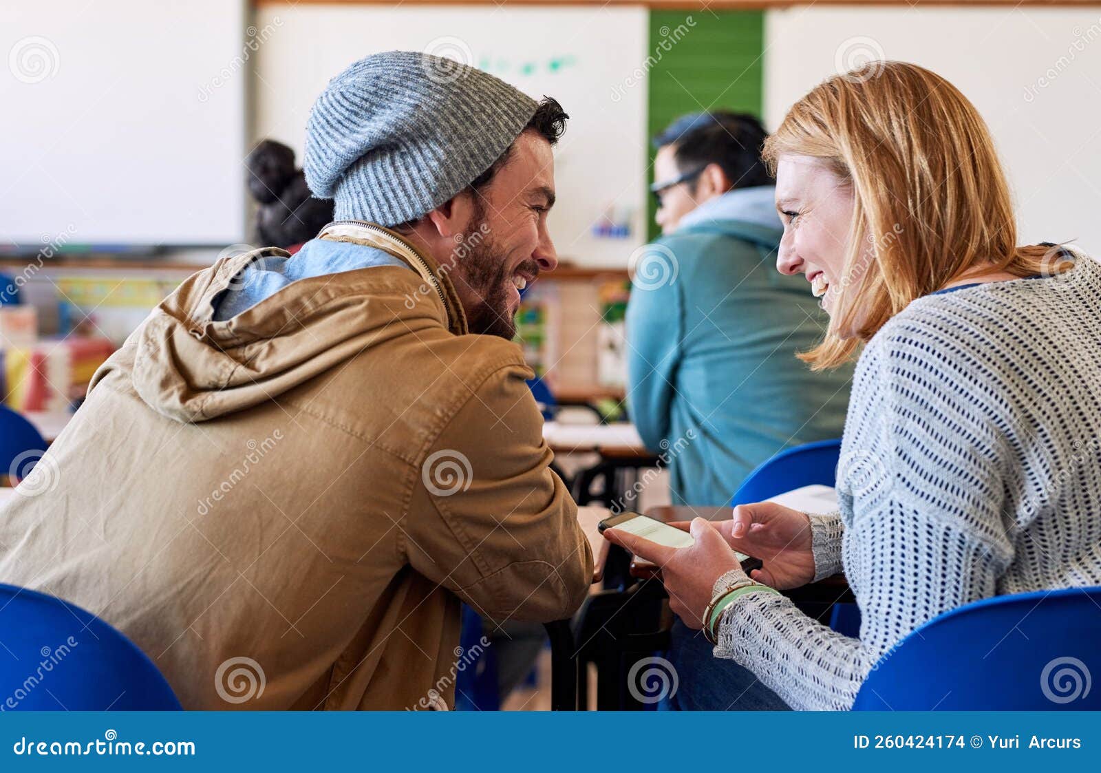 Getting a Little Distracted. Rearview Shot of Two Young University ...
