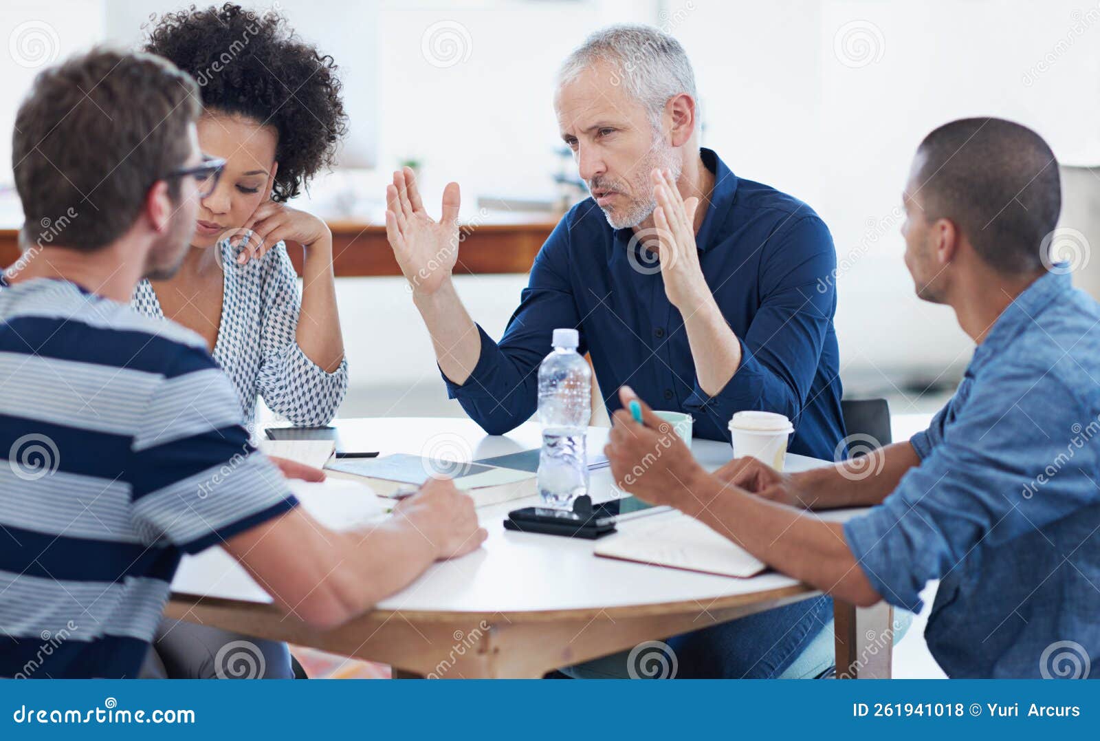 Getting into the Nitty Gritty of the Project. a Group of Designers at ...