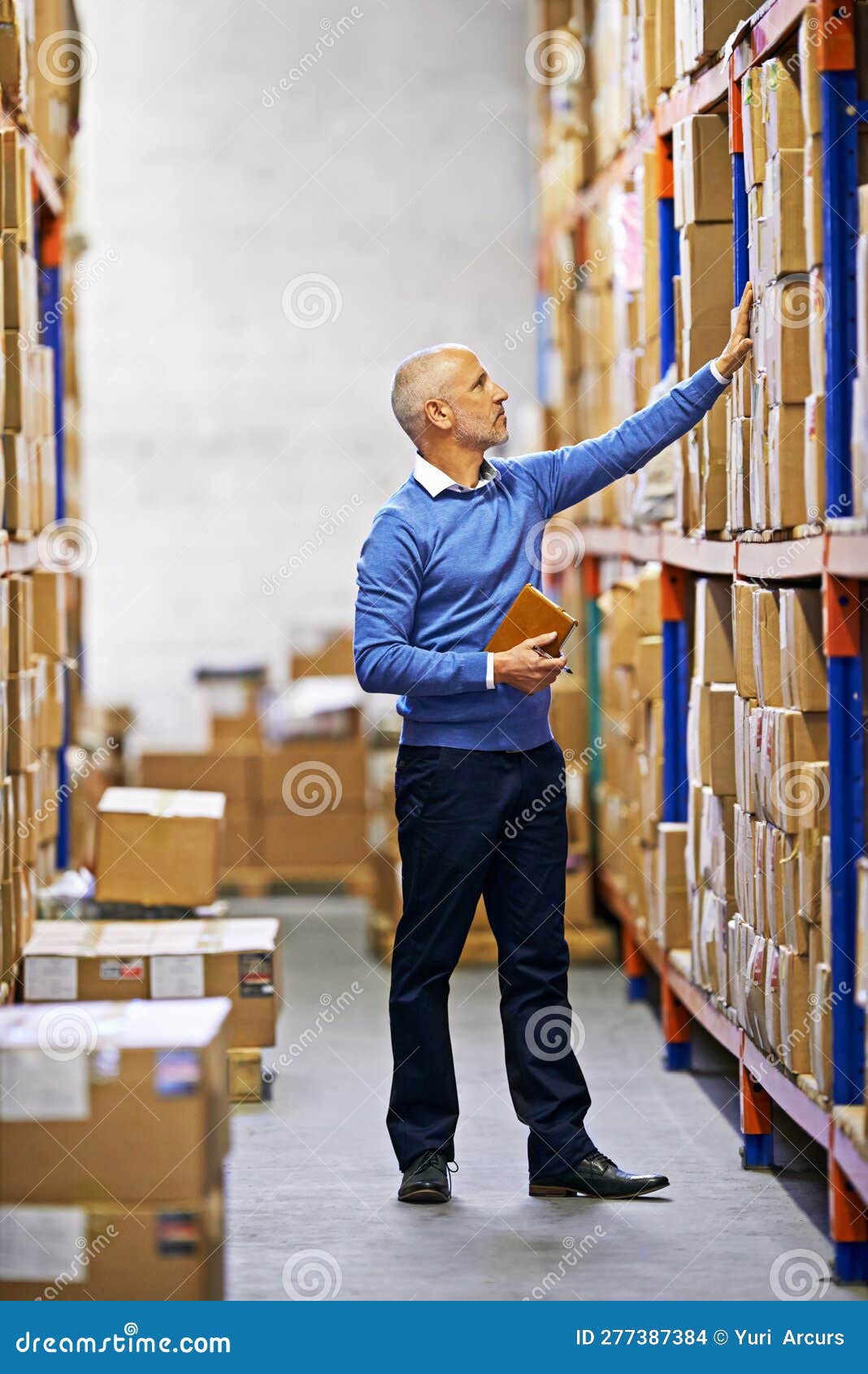 Getting Orders Ready for Shipping. a Mature Man Working Inside in a ...