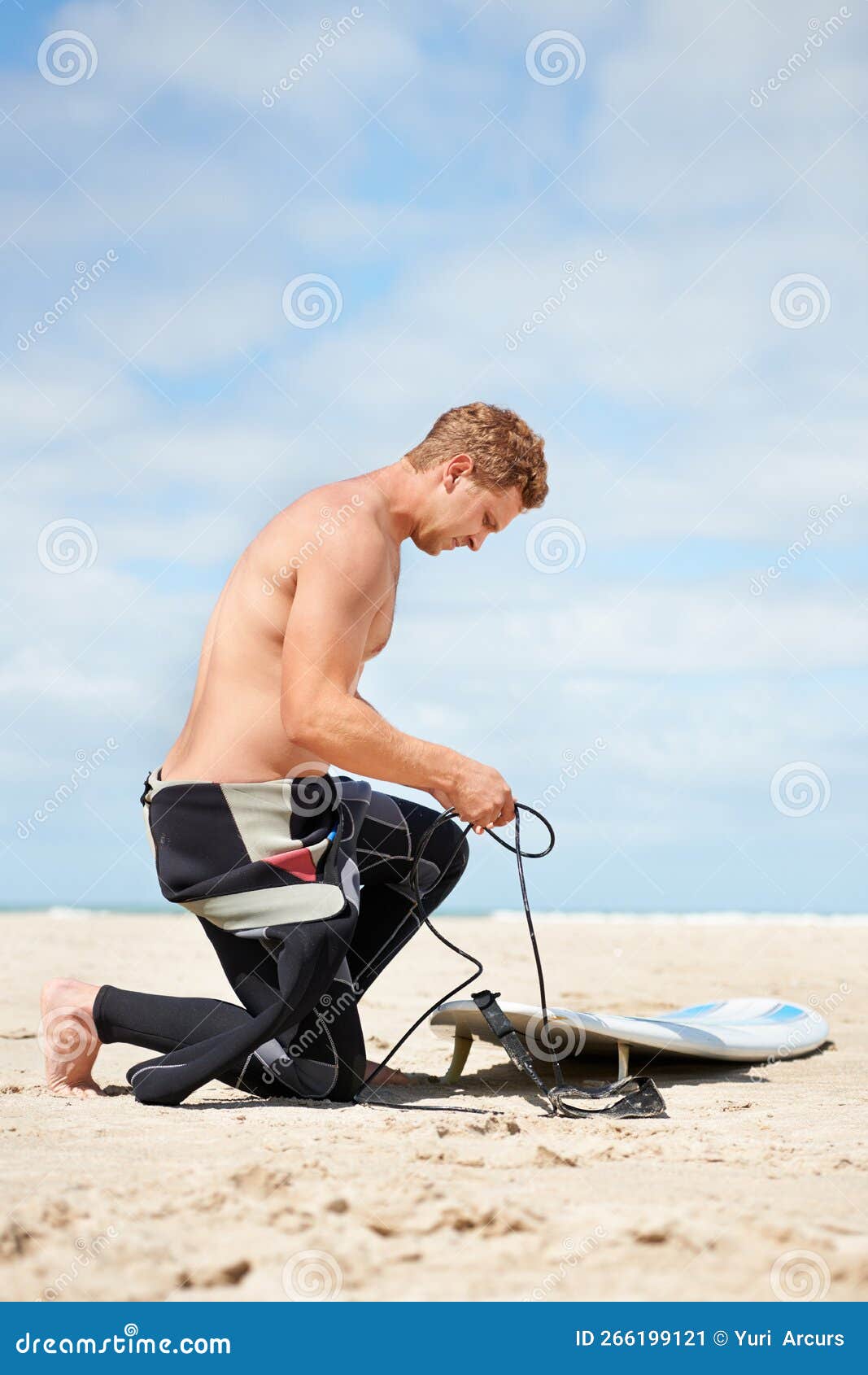 Getting Ready To Go Surfing. a Young Man in a Wetsuit Getting Ready for ...