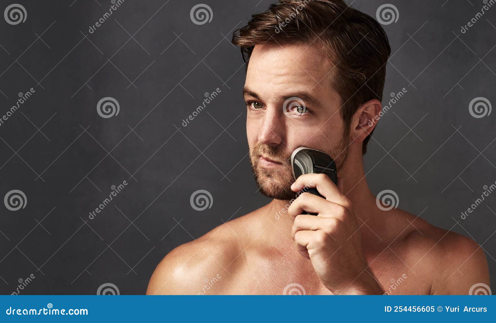 Getting Rid of the Beard. Cropped Portrait of a Handsome Young Man ...