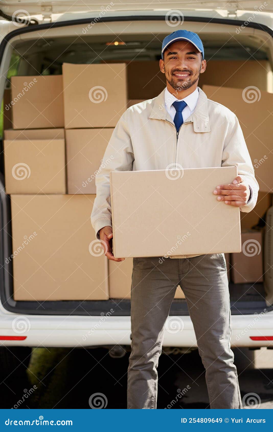 Getting it Right and on Time. Portrait of a Friendly Delivery Man ...