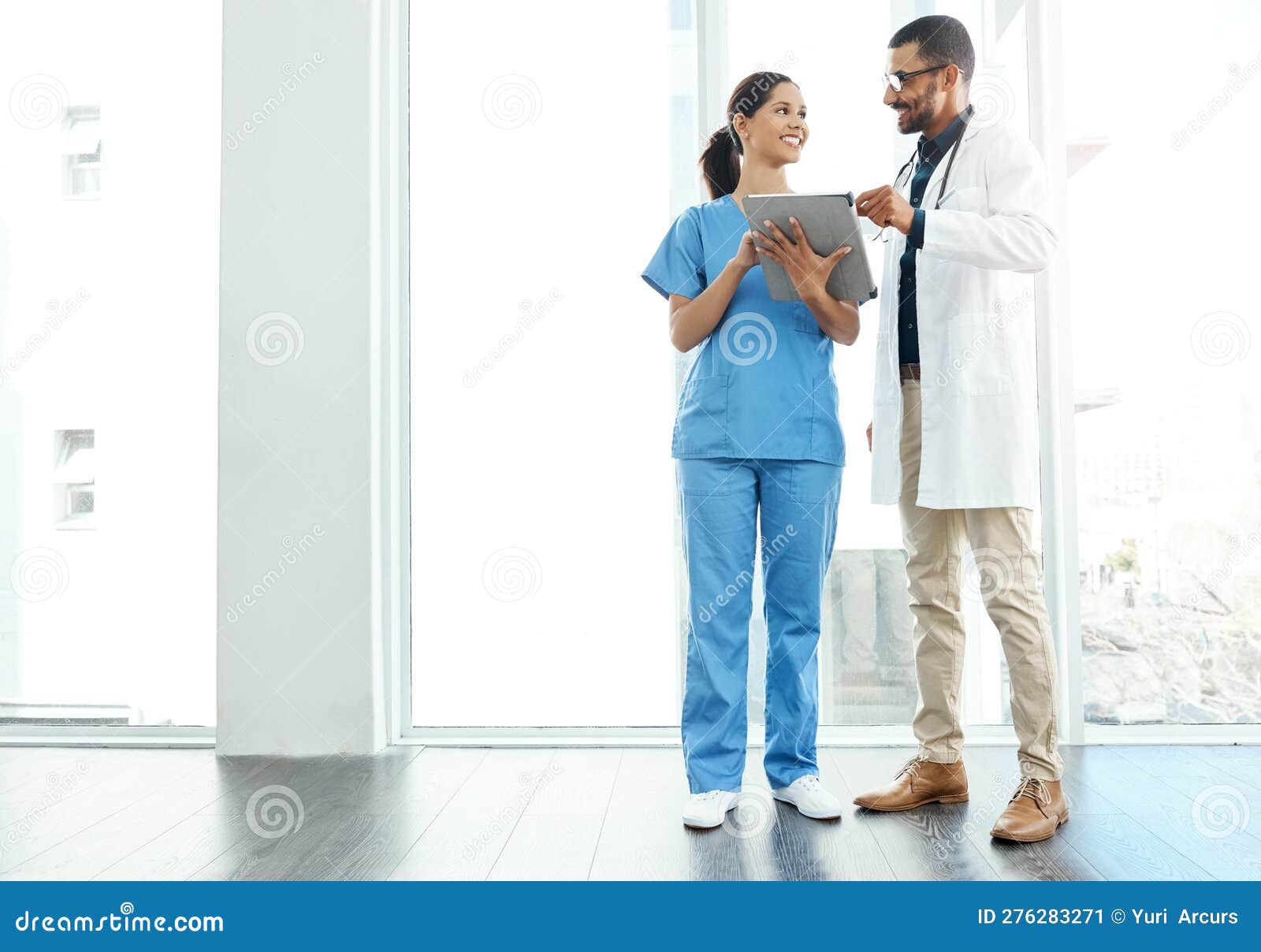 Getting a Second Opinion Doesnt Hurt. Two Young Doctors Using a Digital ...