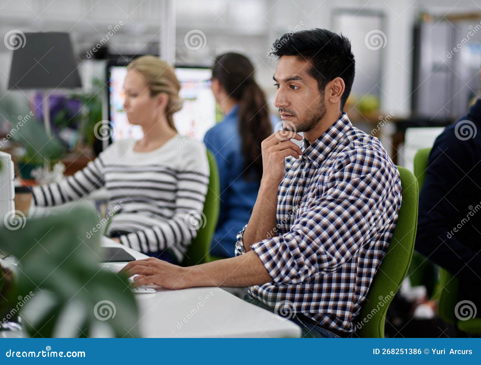 Getting Serious about the Task at Hand. Businessman Working at His Desk ...