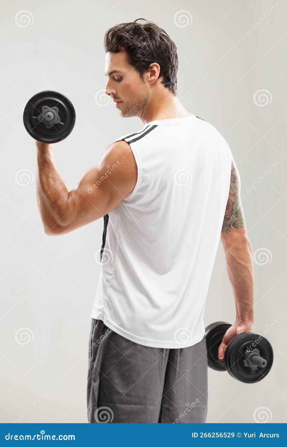 Getting in Shape One Rep at a Time. a Handsome Young Man Using ...