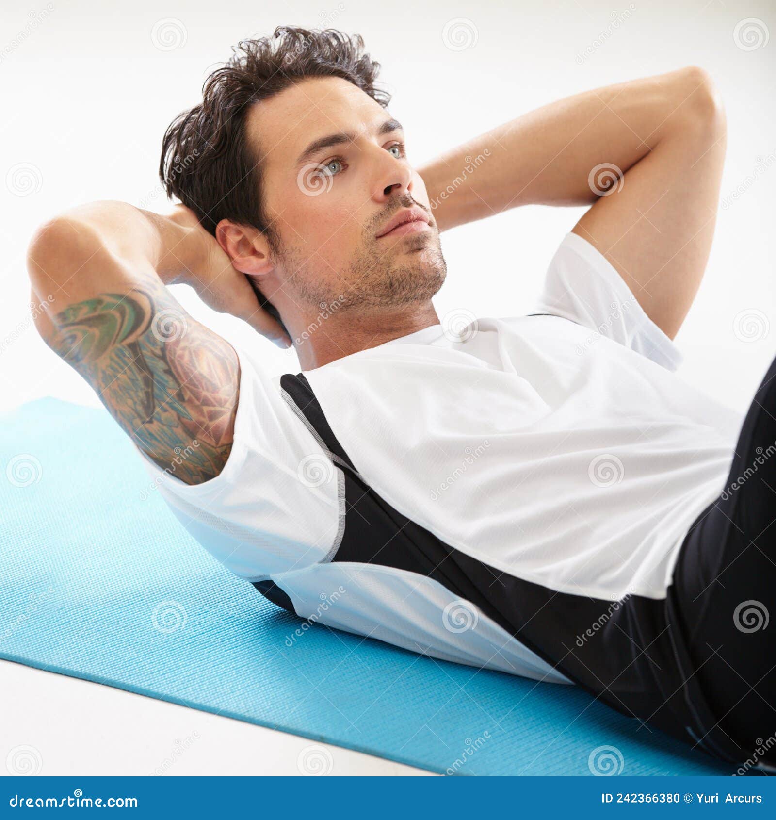 Getting a Six Pack Starts Here. a Handsome Young Man Doing Sit-ups ...