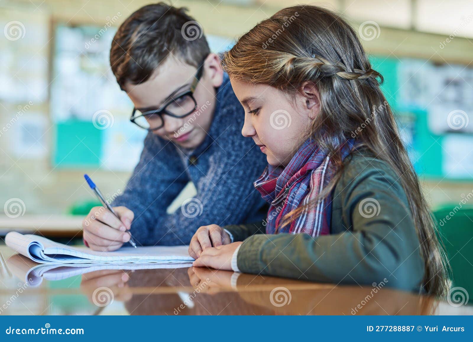 Getting Some Help from a Fellow Classmate. Two Elementary School Kids ...