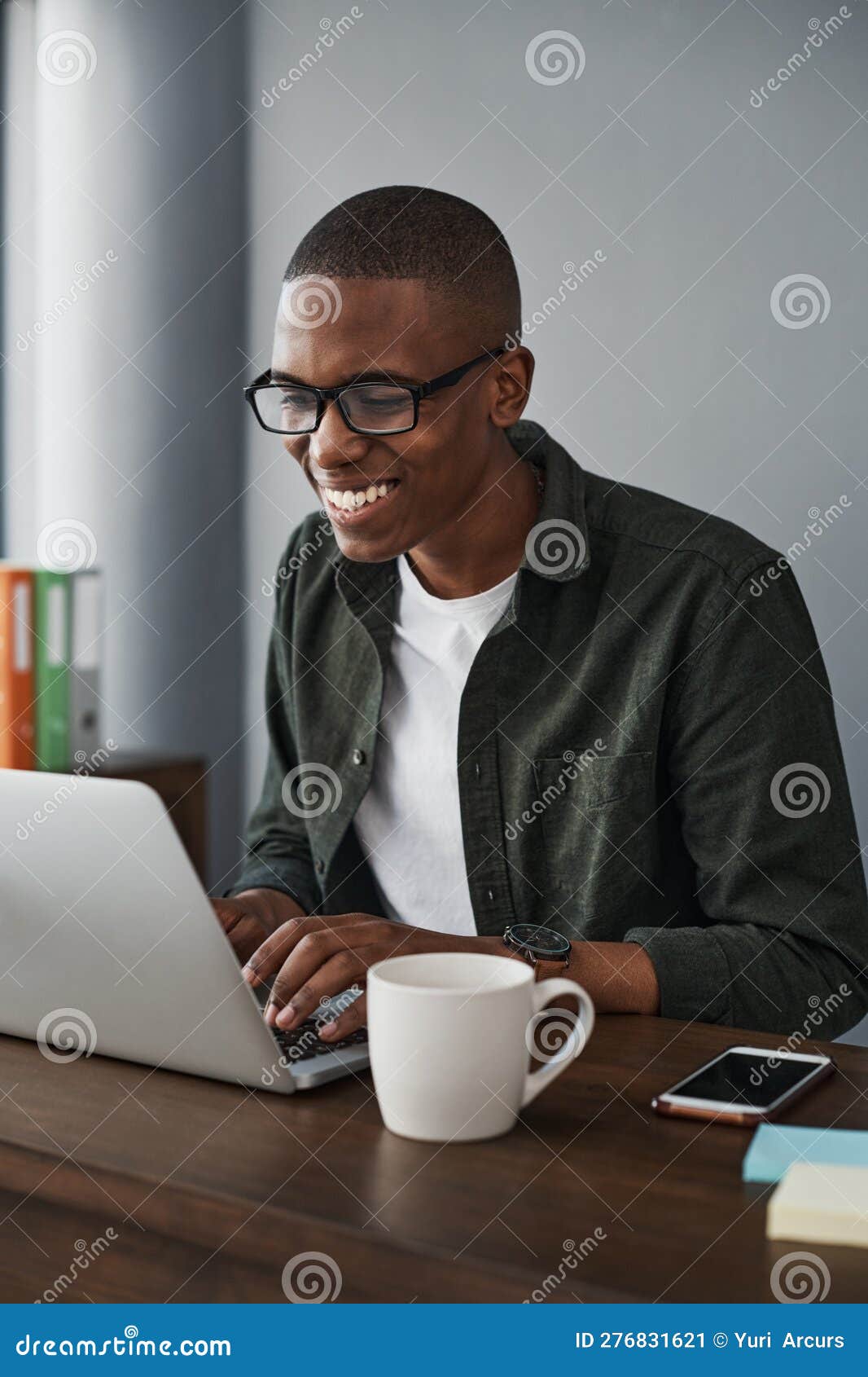 Getting Some Much Needed Work Done. a Young Businessman Typing on His ...