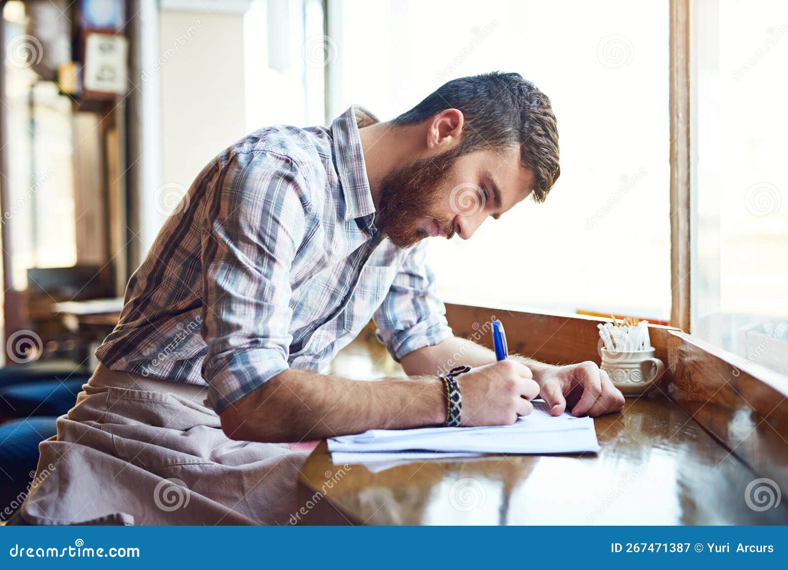 Getting Some Work Done. a Shop Owner Doing Some Paperwork. Stock Image ...