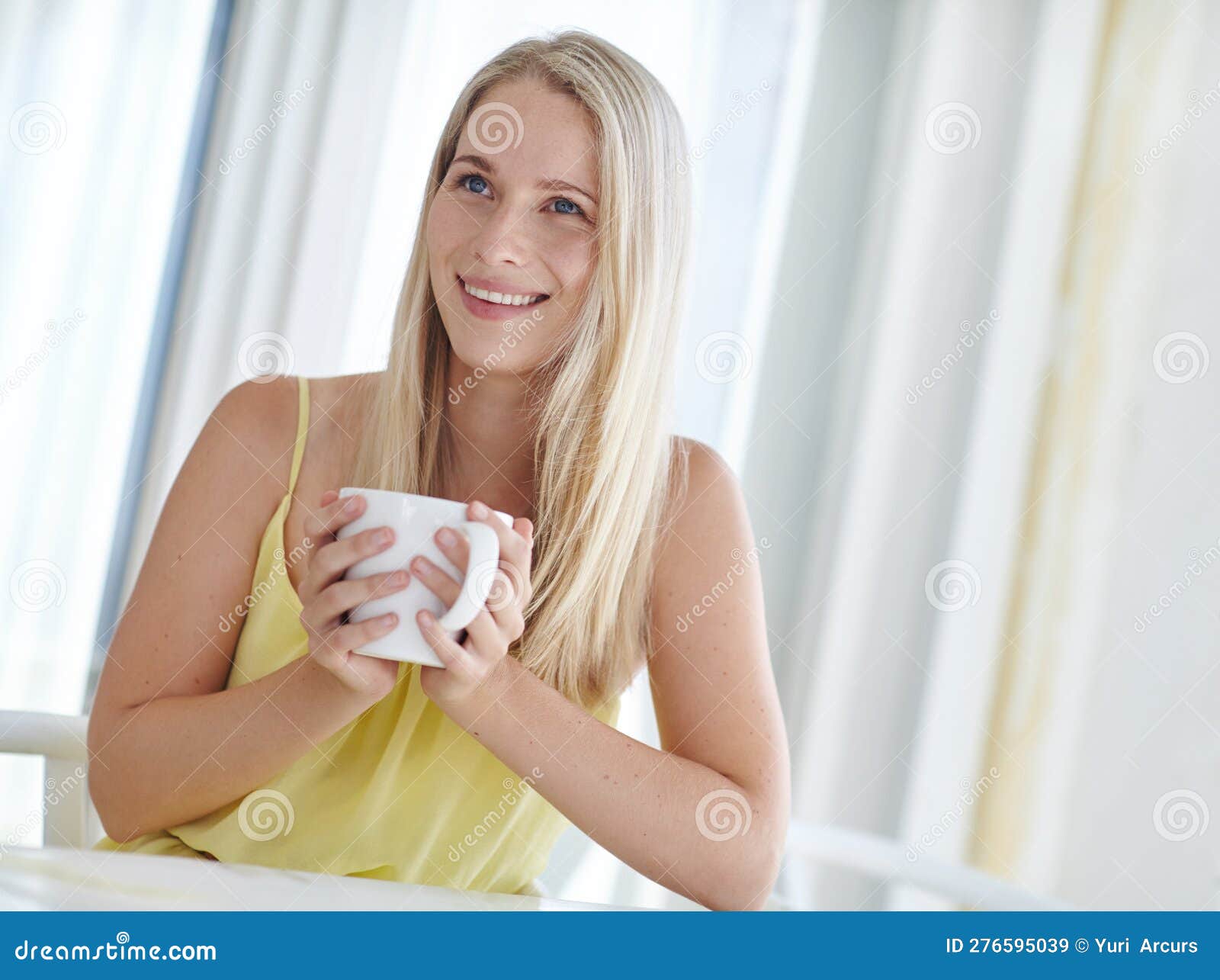 Getting Started with a Cup of Java. an Attractive Young Woman Drinking ... Getting Started with a Cup of Java. an Attractive Young Woman Drinking ...