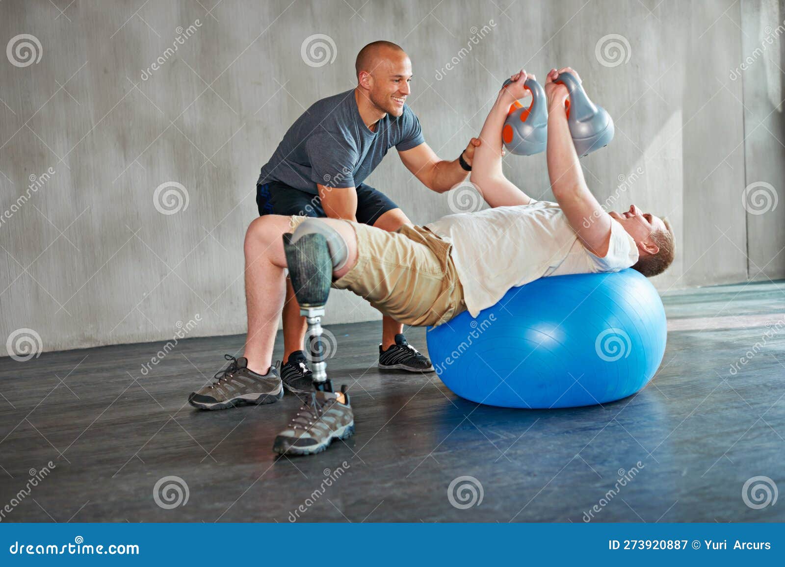 Getting Stronger. Studio Shot of a Young Amputee Training in a Gym ...