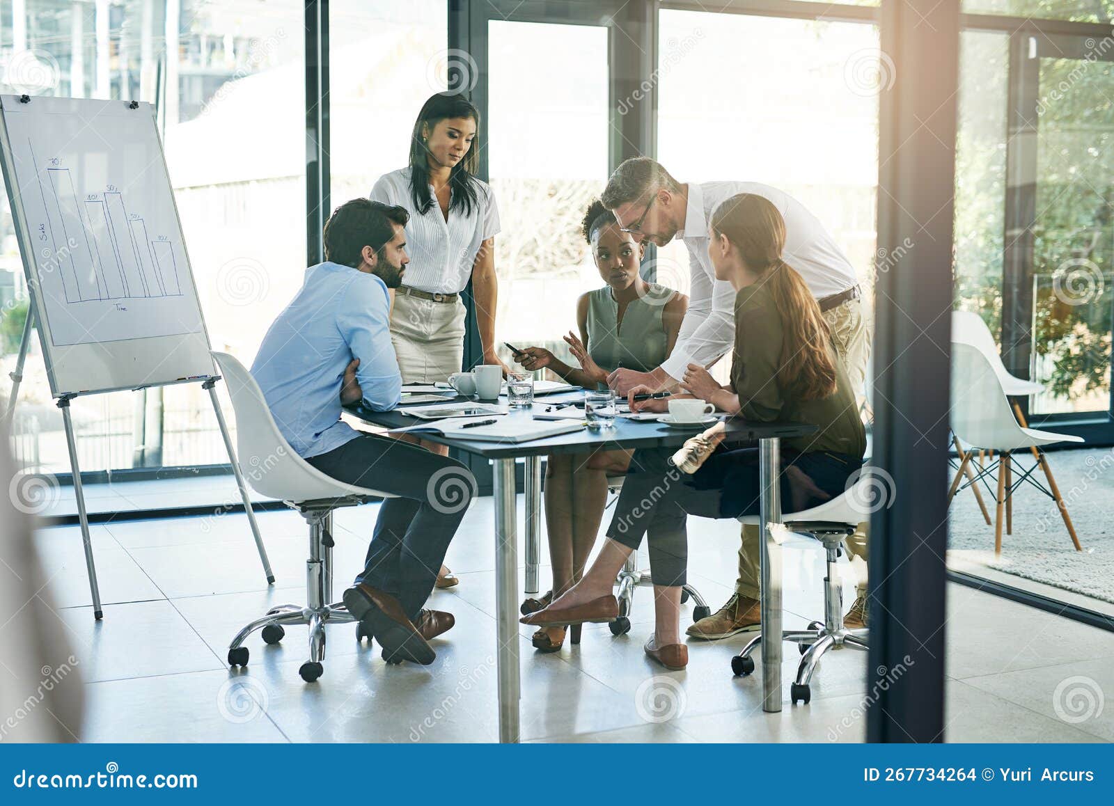 Getting Their Plans Together. a Group of Colleagues Working Together in ...