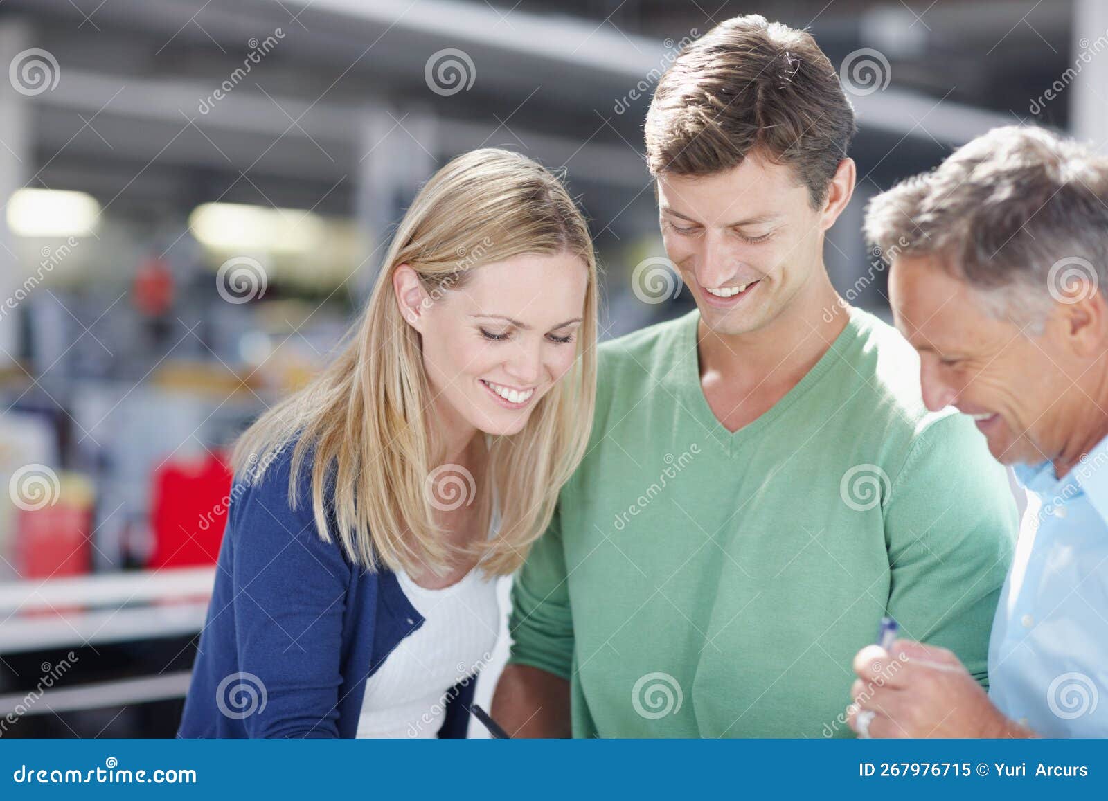 Getting Things Done As a Team. Three Work Colleagues Discussing ...