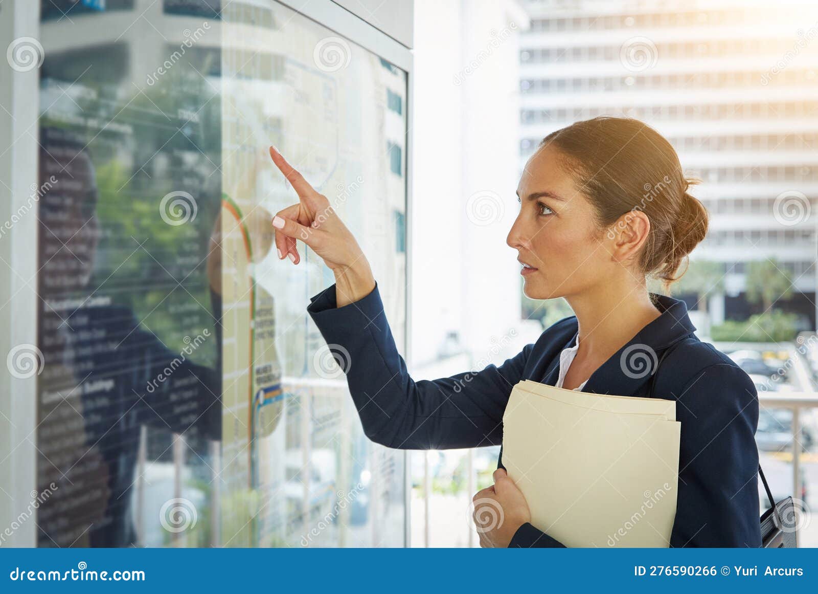 Getting To Where she Needs To Be. a Businesswoman Reading a Route ...