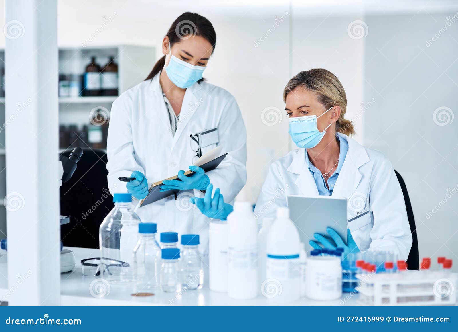 Getting Together for Some Lab Work. Two Scientists Working Together in ...