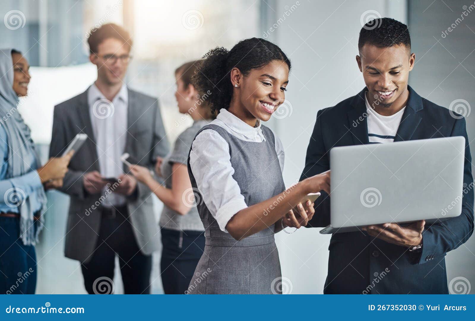 Getting Up To Work Things. a Group of Young Cheerful Businesspeople ...