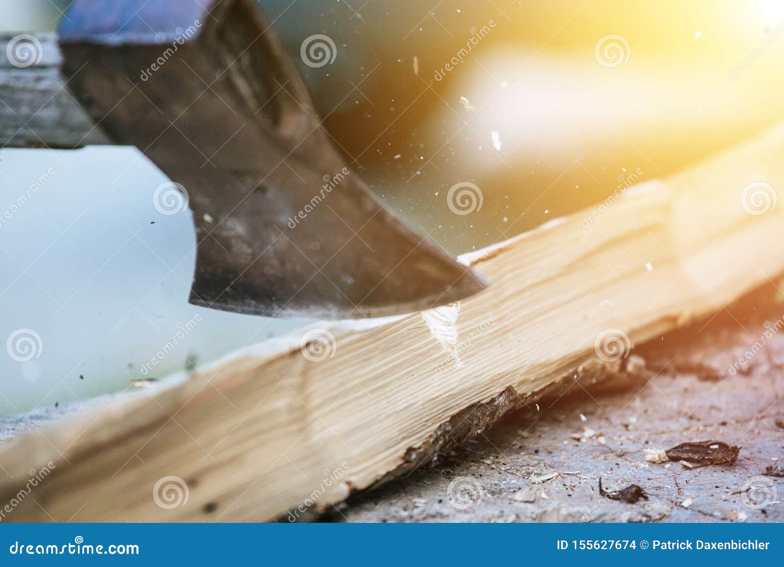 Getting Wood for Fire: Sharp Axe Cutting Wood on a Block. Sunlight ...