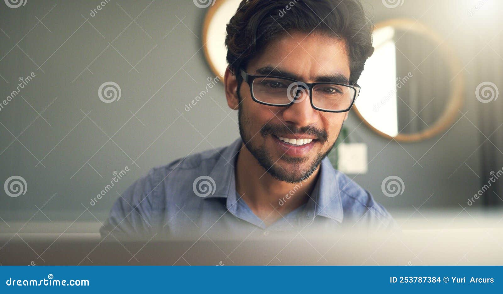 Getting Work Done Easily at Home. a Handsome Young Businessman Working ...