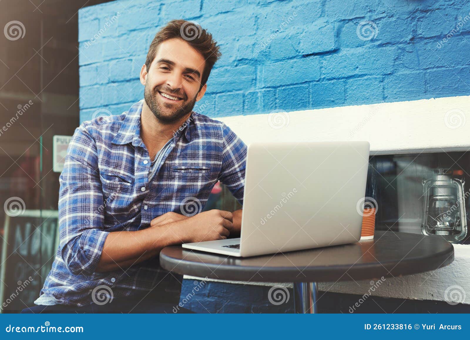 Getting Work Done the Fun Way. a Handsome Young Man Sitting at a ...