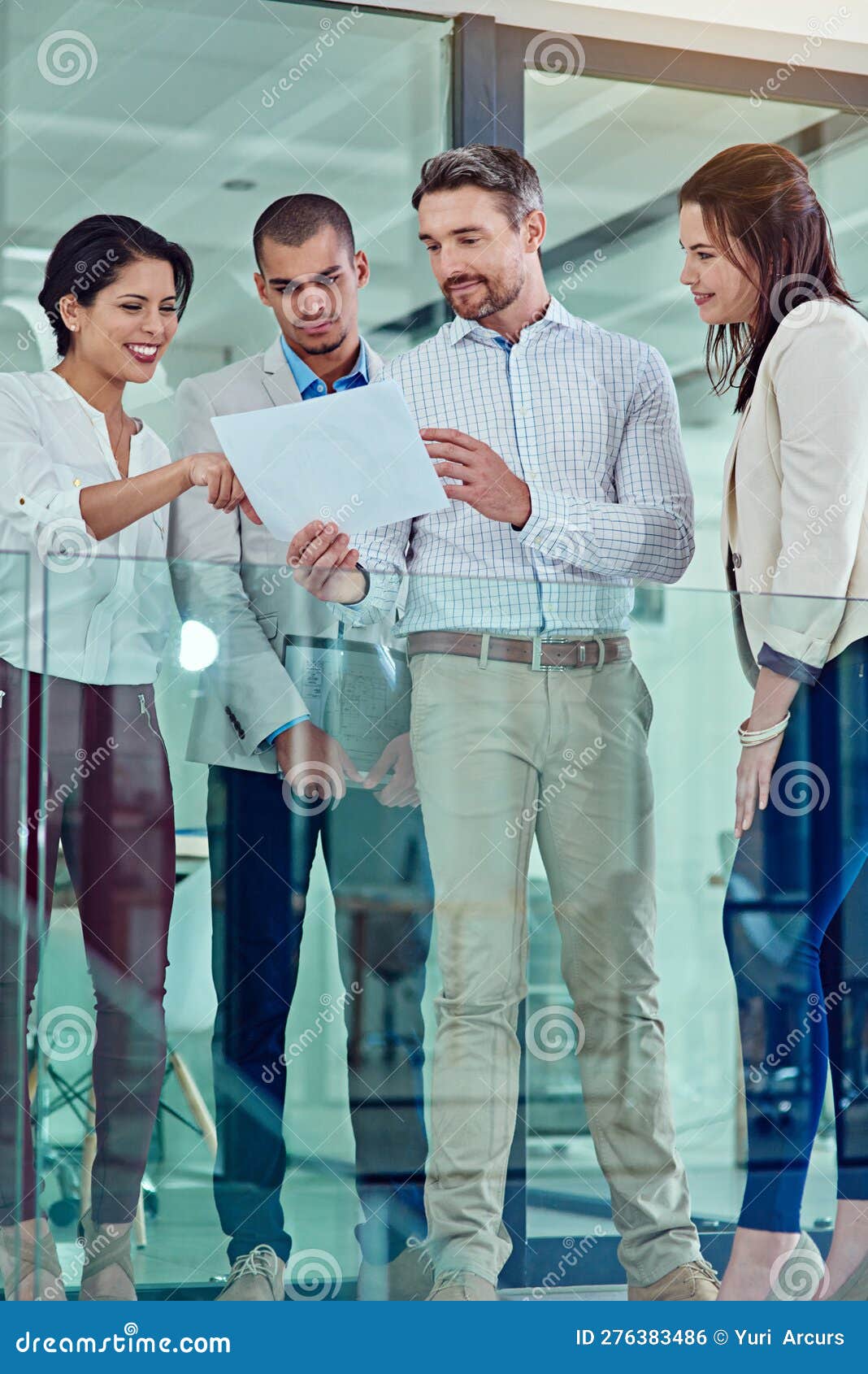 Getting Work Done, Together. a Group of Coworkers Talking Over Some ...