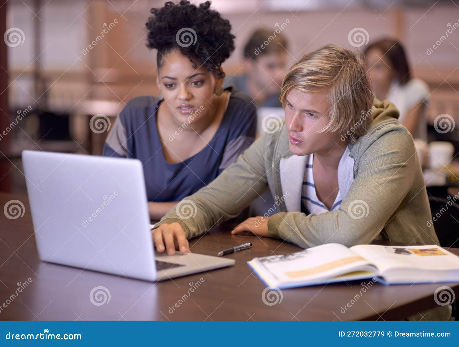 Getting through the Work Together. Two Students Researching Their ...