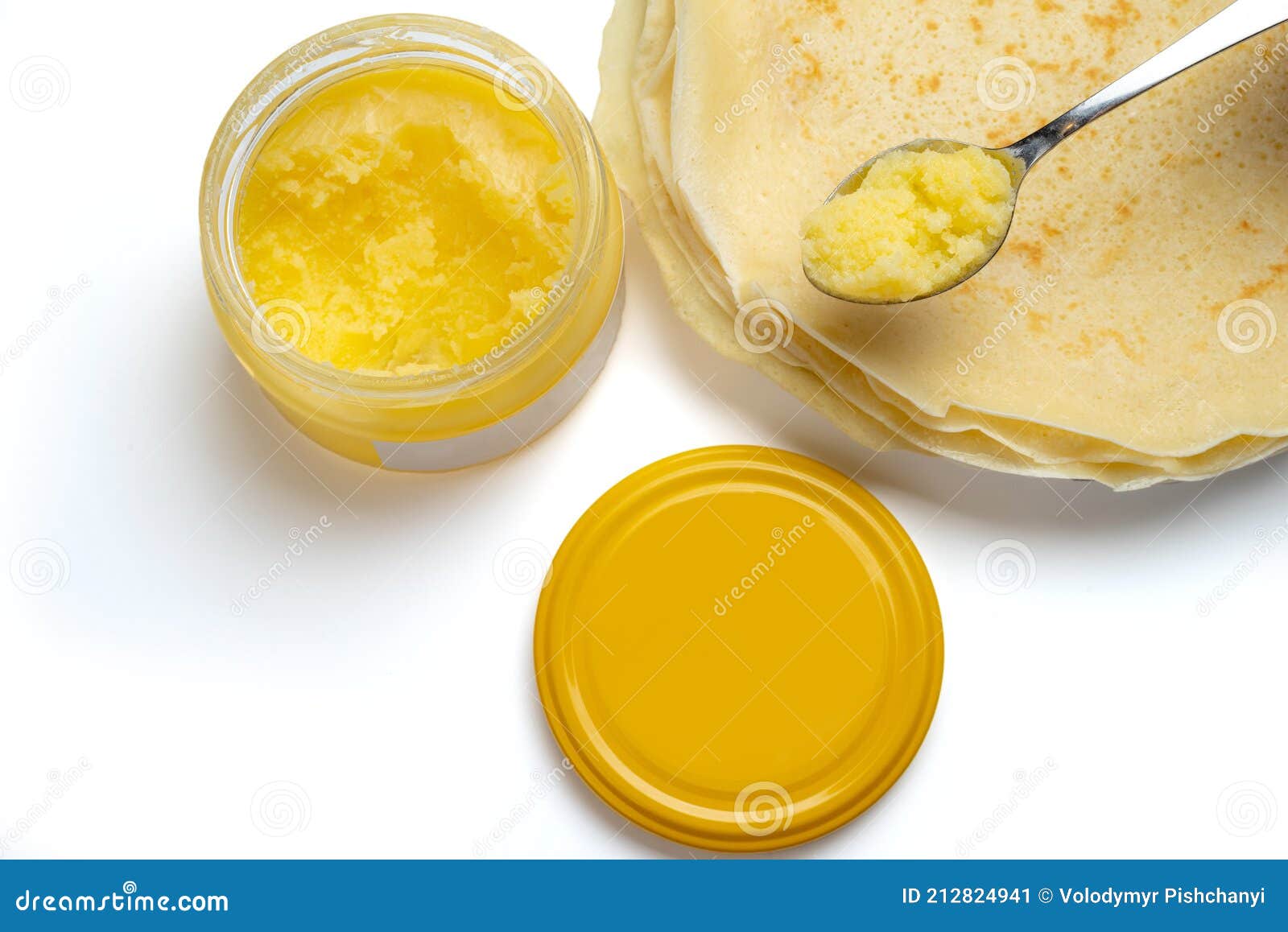 Ghee in a Spoon and Glass Jar Near a Stack of Pancakes. Stock Image ...