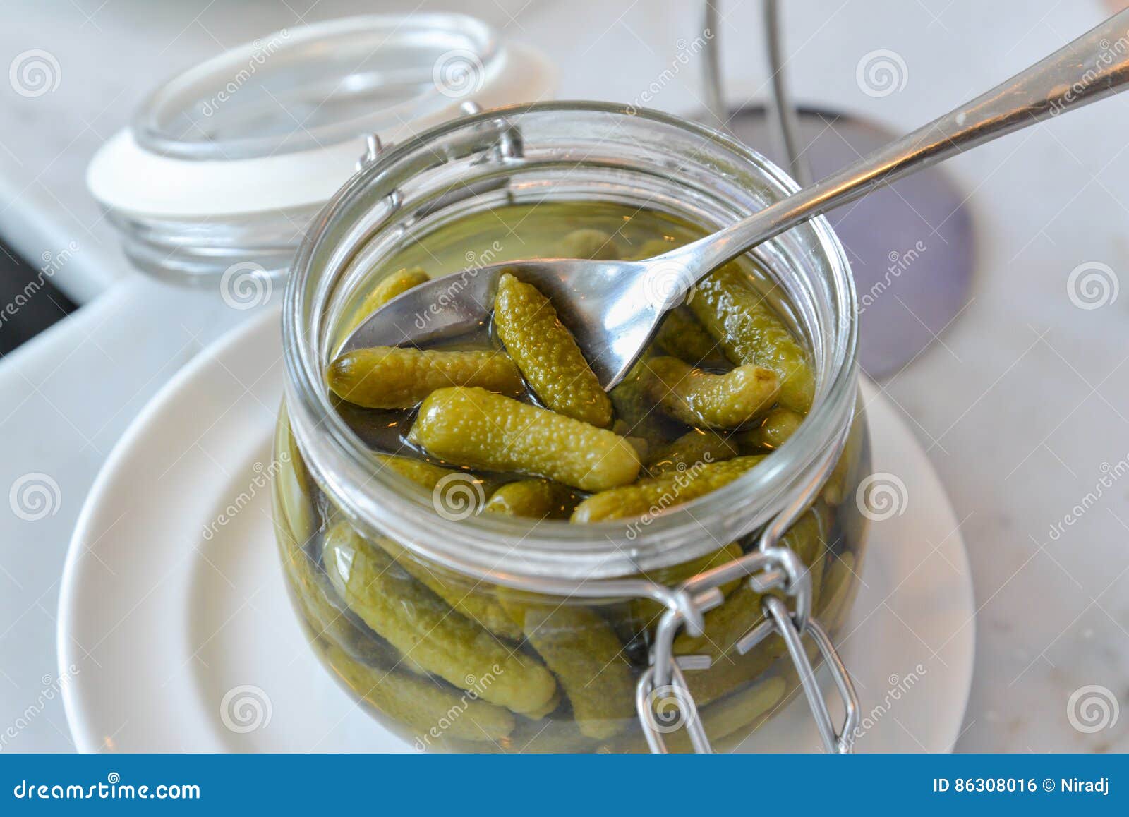 Gherkin in glass jars stock photo. Image of breakfast - 86308016