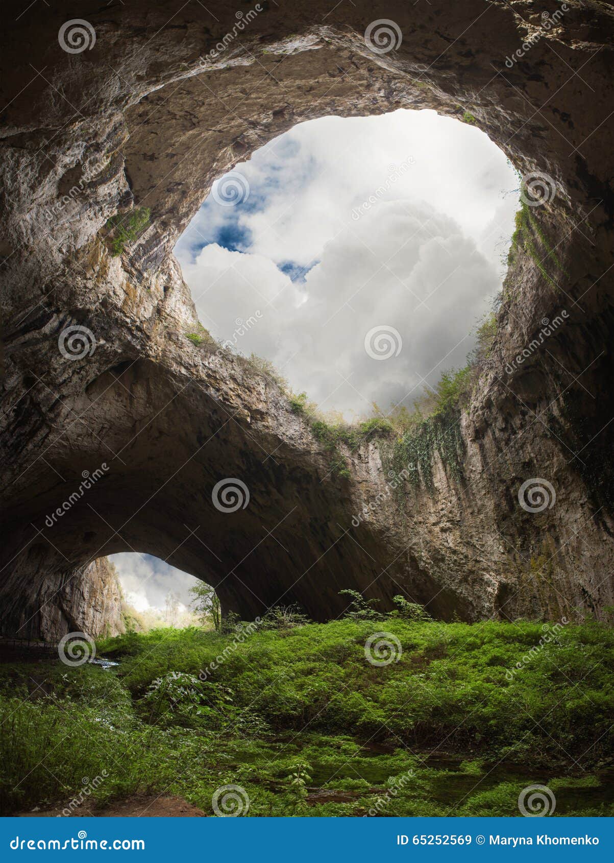 Giant cave holes stock image. Image of green, rock, landscape - 65252569