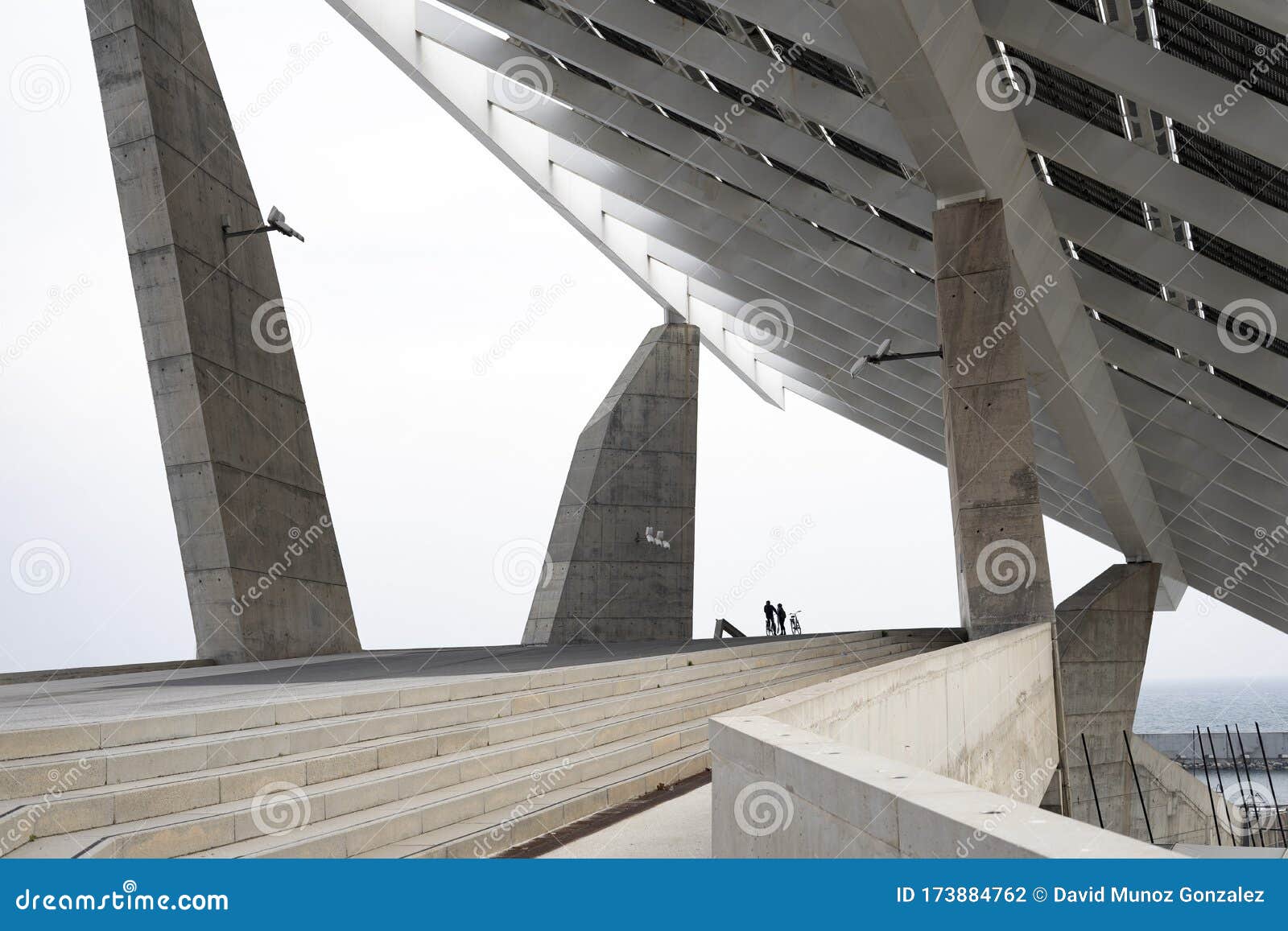 Giant Concrete Structure with Two People in the Background Stock Photo ...