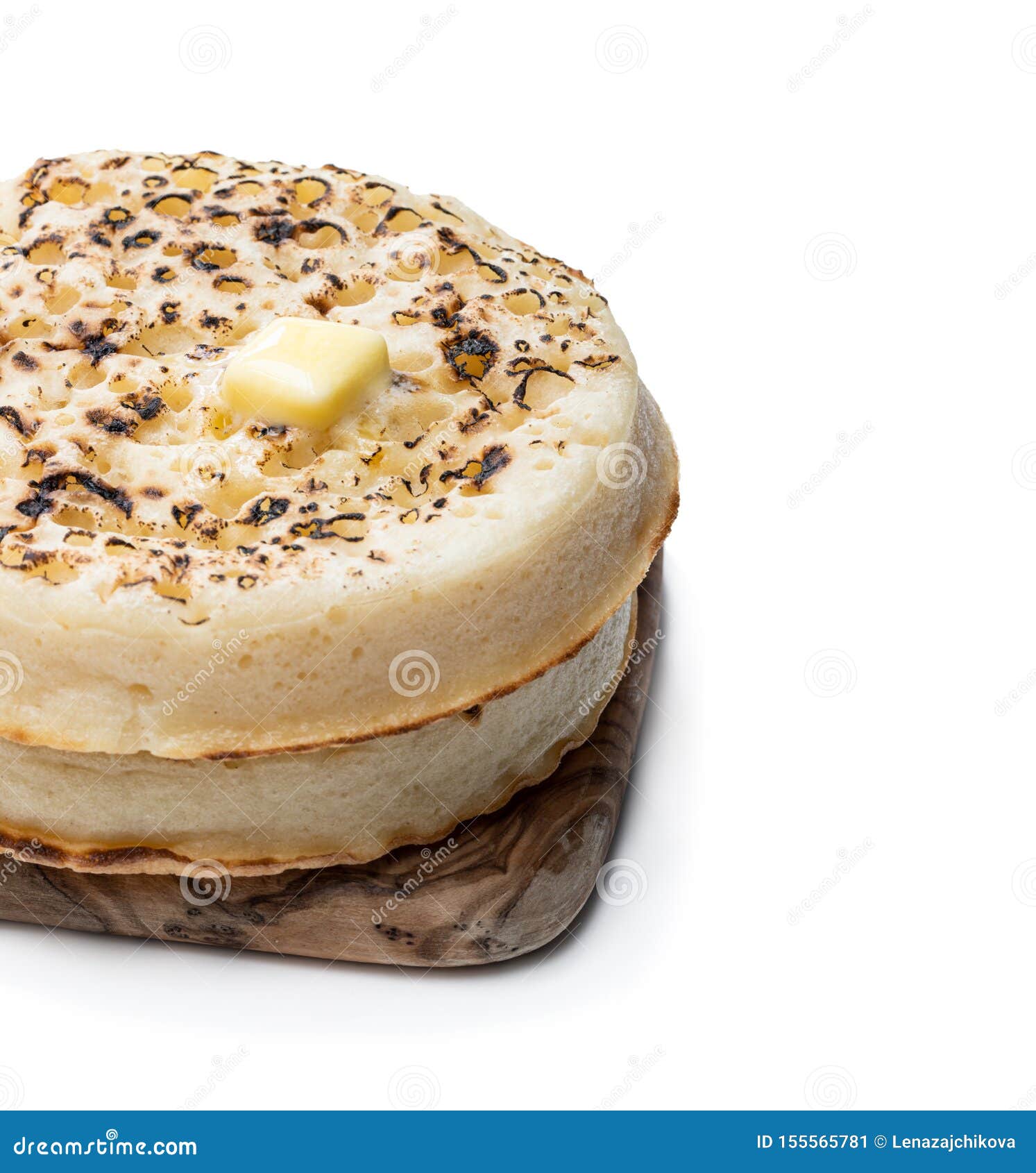 Giant Crumpets with Melted Butter on Cutting Board Isolated on White ...