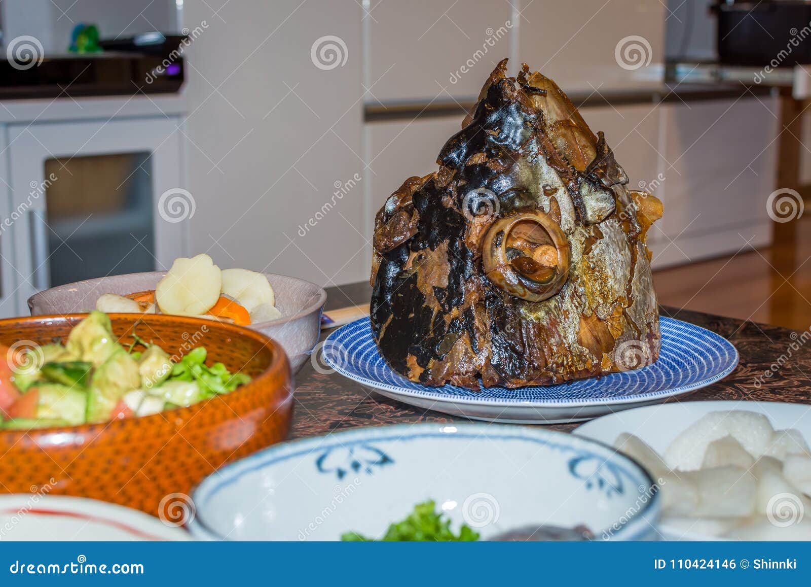 Giant fish head on a plate stock photo. Image of weird - 110424146