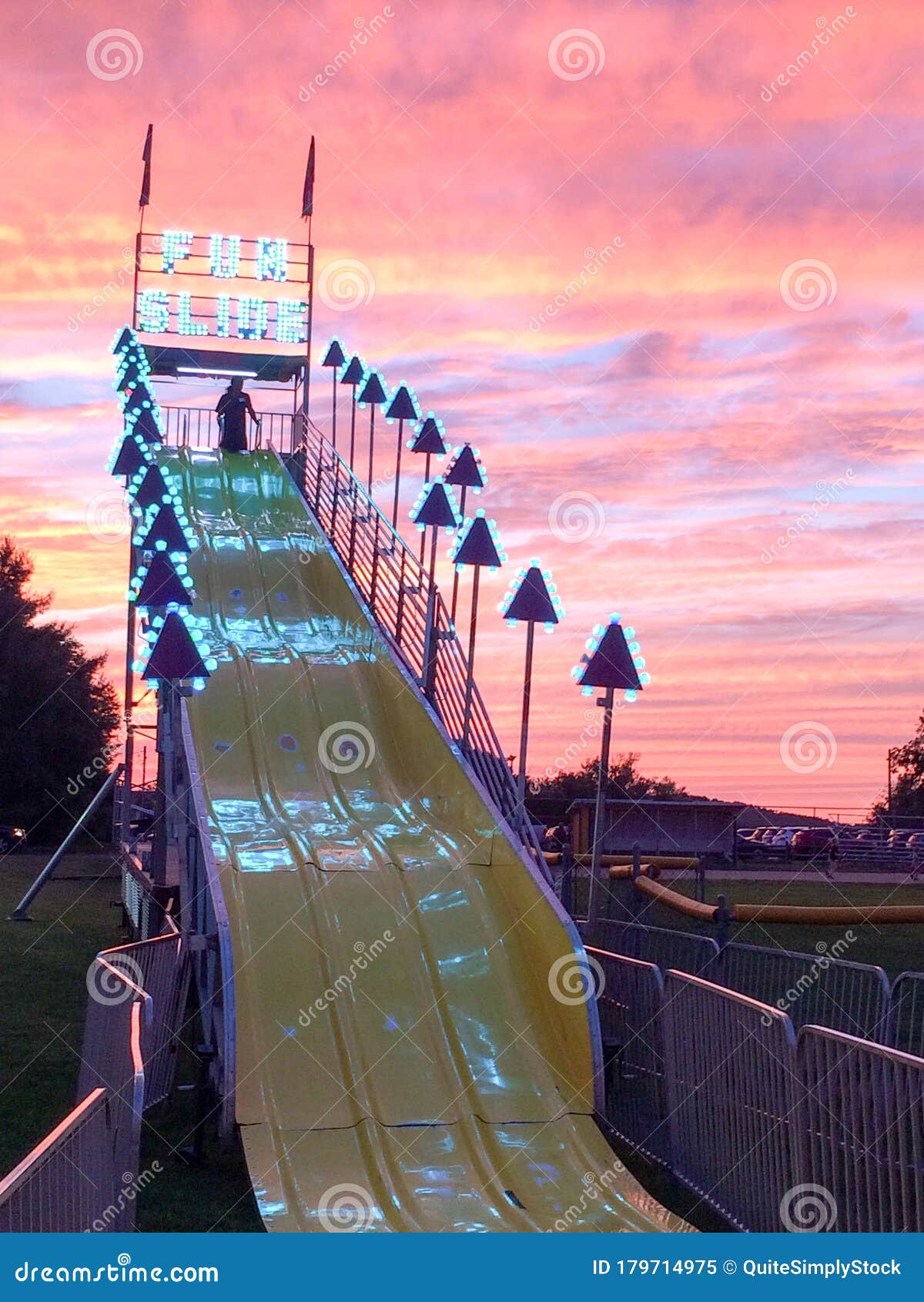 Giant Fun Slide at Fairgrounds at Sunset Stock Image - Image of ...
