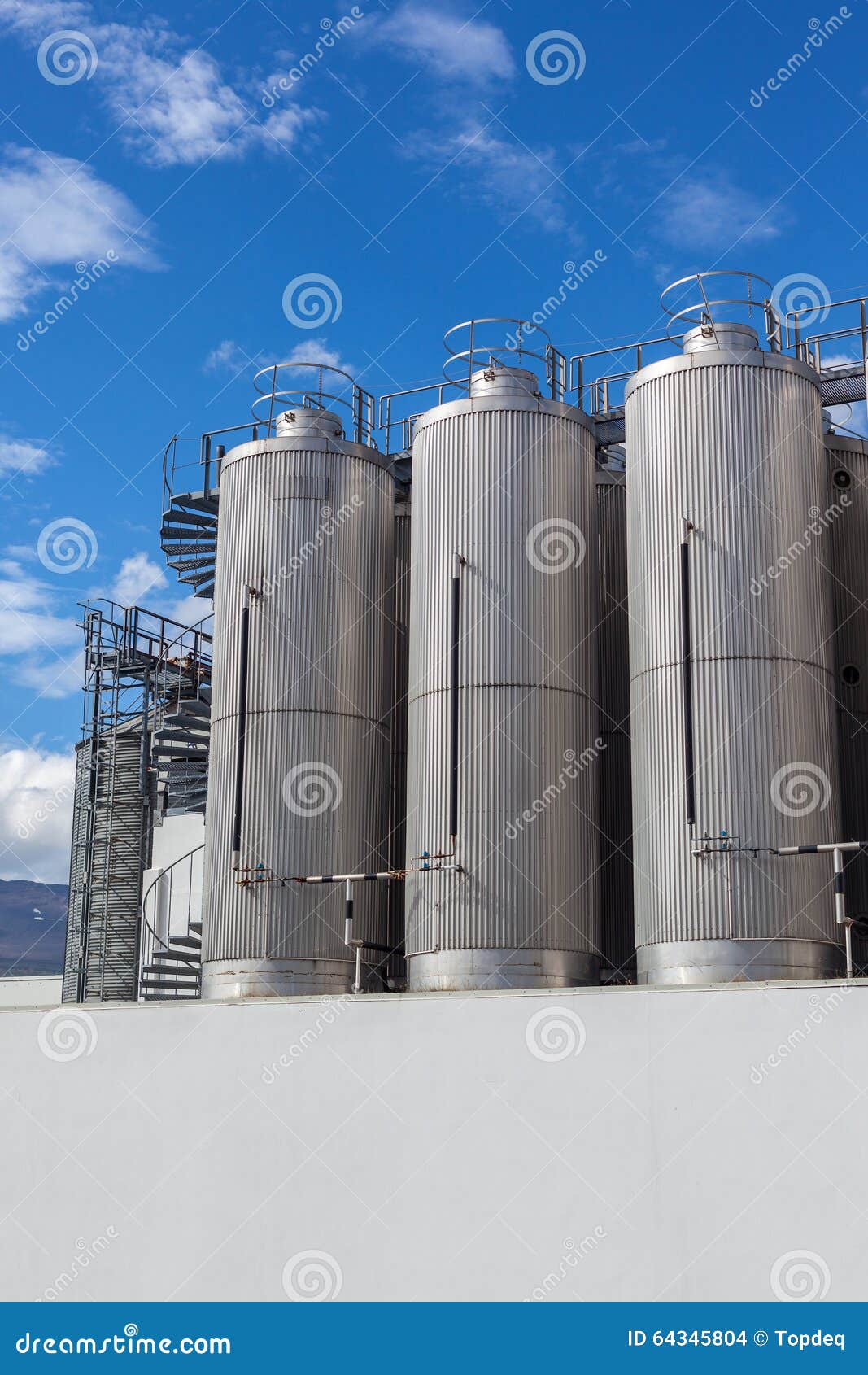 Giant Industrial Tanks on the Bright Blue Sky Stock Photo - Image of ...