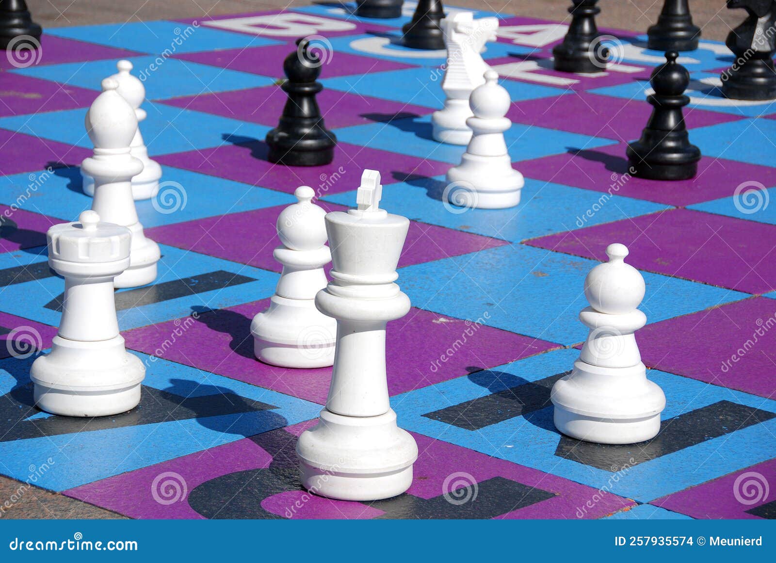 A giant outdoor chess game stock photo. Image of dark - 257935574