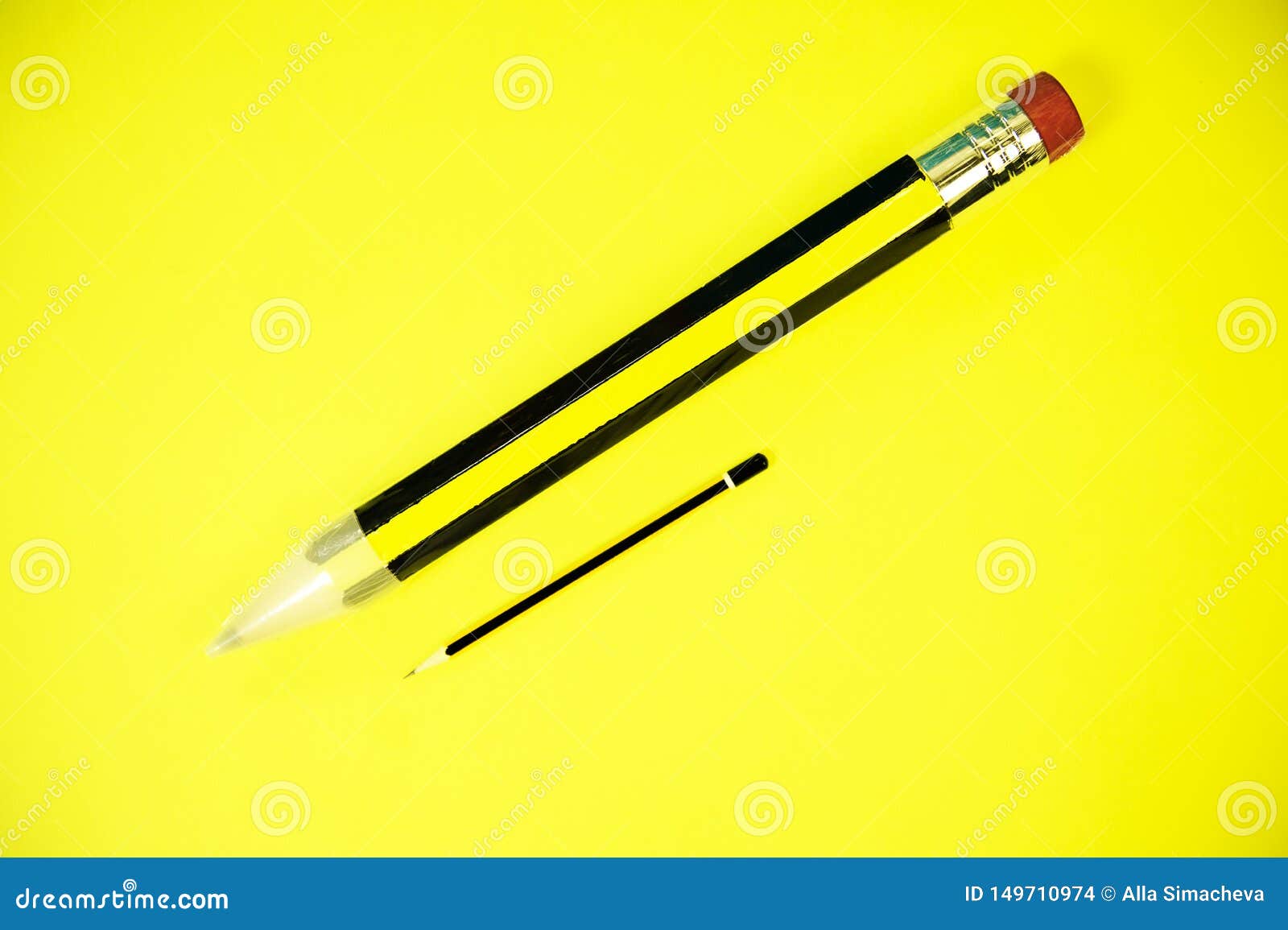 A Giant Pencil and a Little Ordinary Pencil Stock Photo - Image of ... A Giant Pencil and a Little Ordinary Pencil Stock Photo - Image of ...