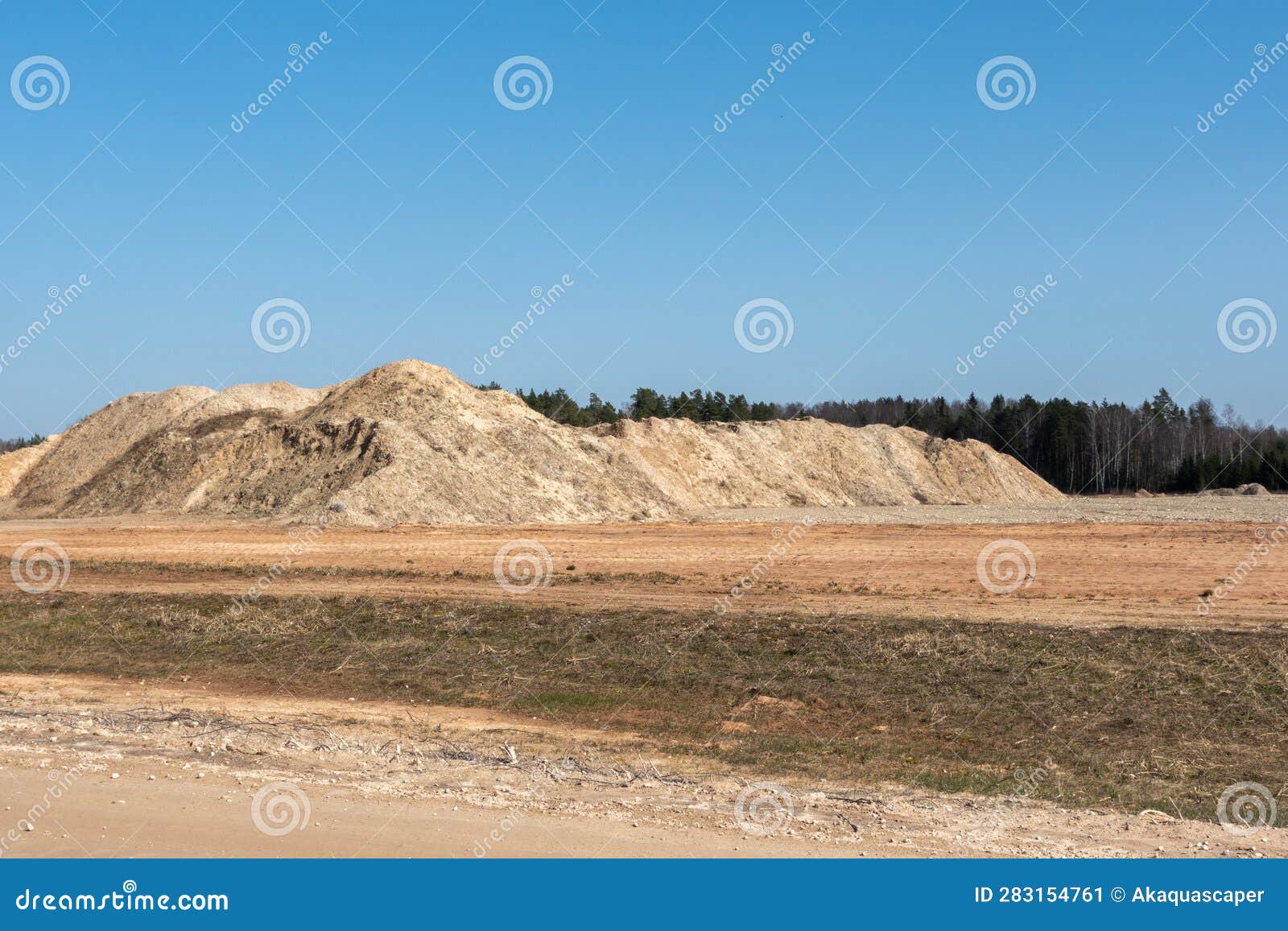 Giant Pile of Sand Against the Blue Sky. Sand Extraction Mine Stock ...