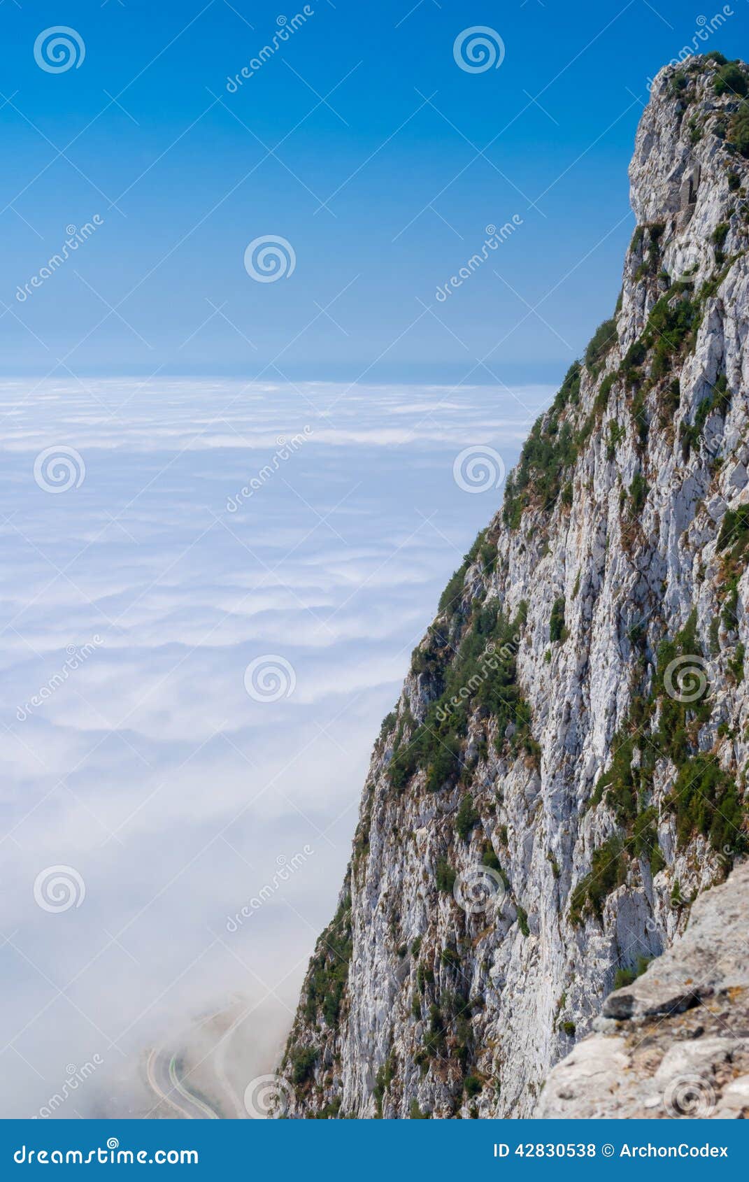 Gibraltar Cliff Face Above Clouds on Sky. Stock Photo - Image of ...