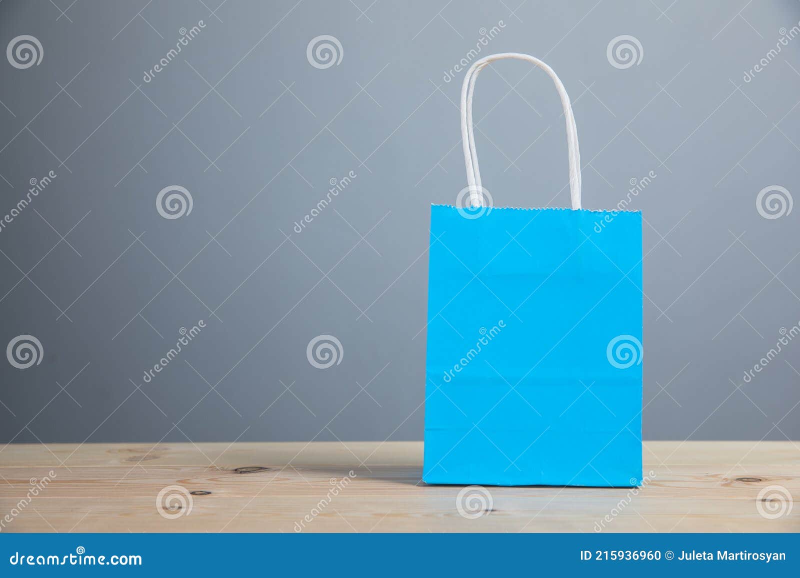 Gift bag on the table stock photo. Image of design, merchandise - 215936960